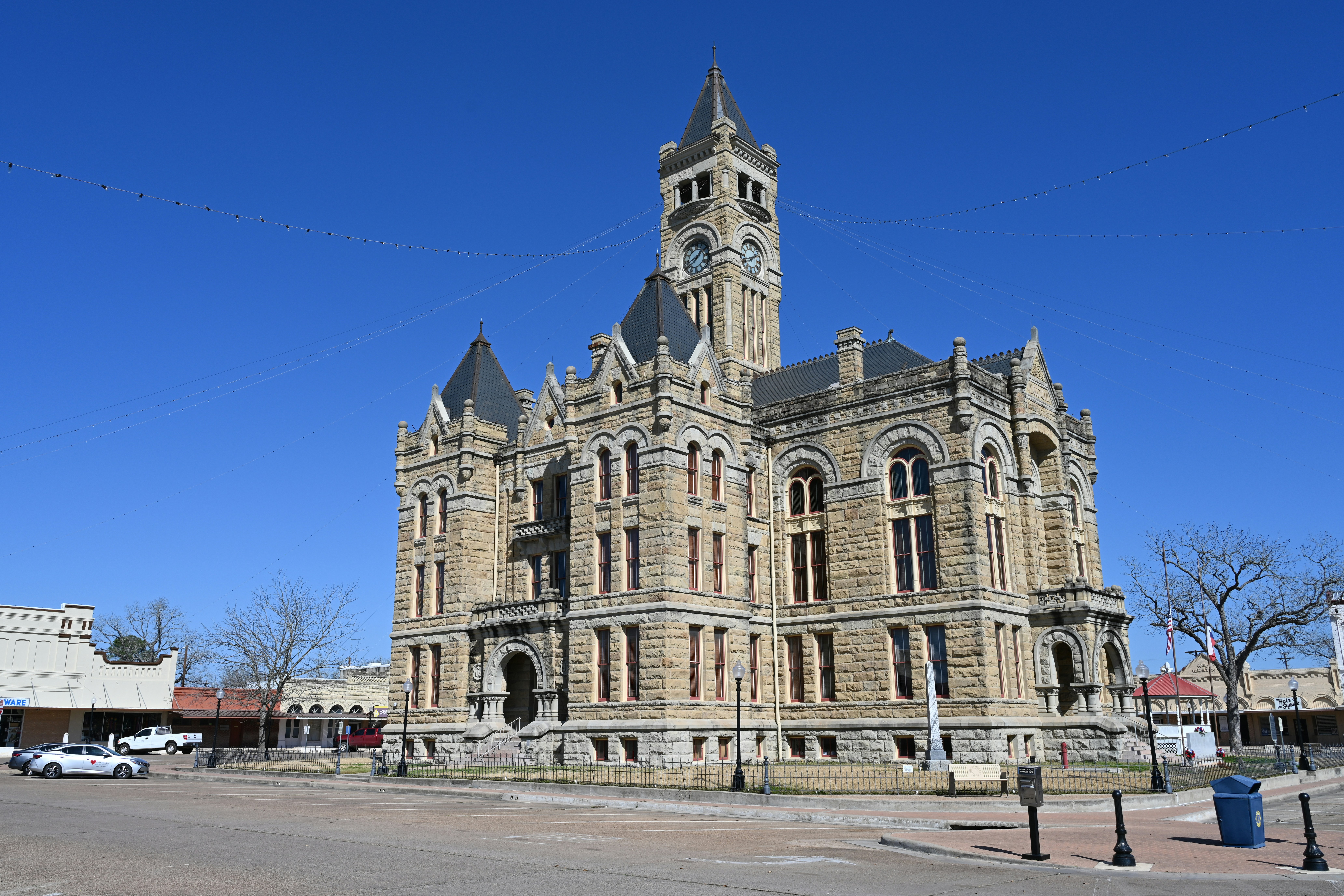 A large building with a clock tower on top of it photo – Free Building ...