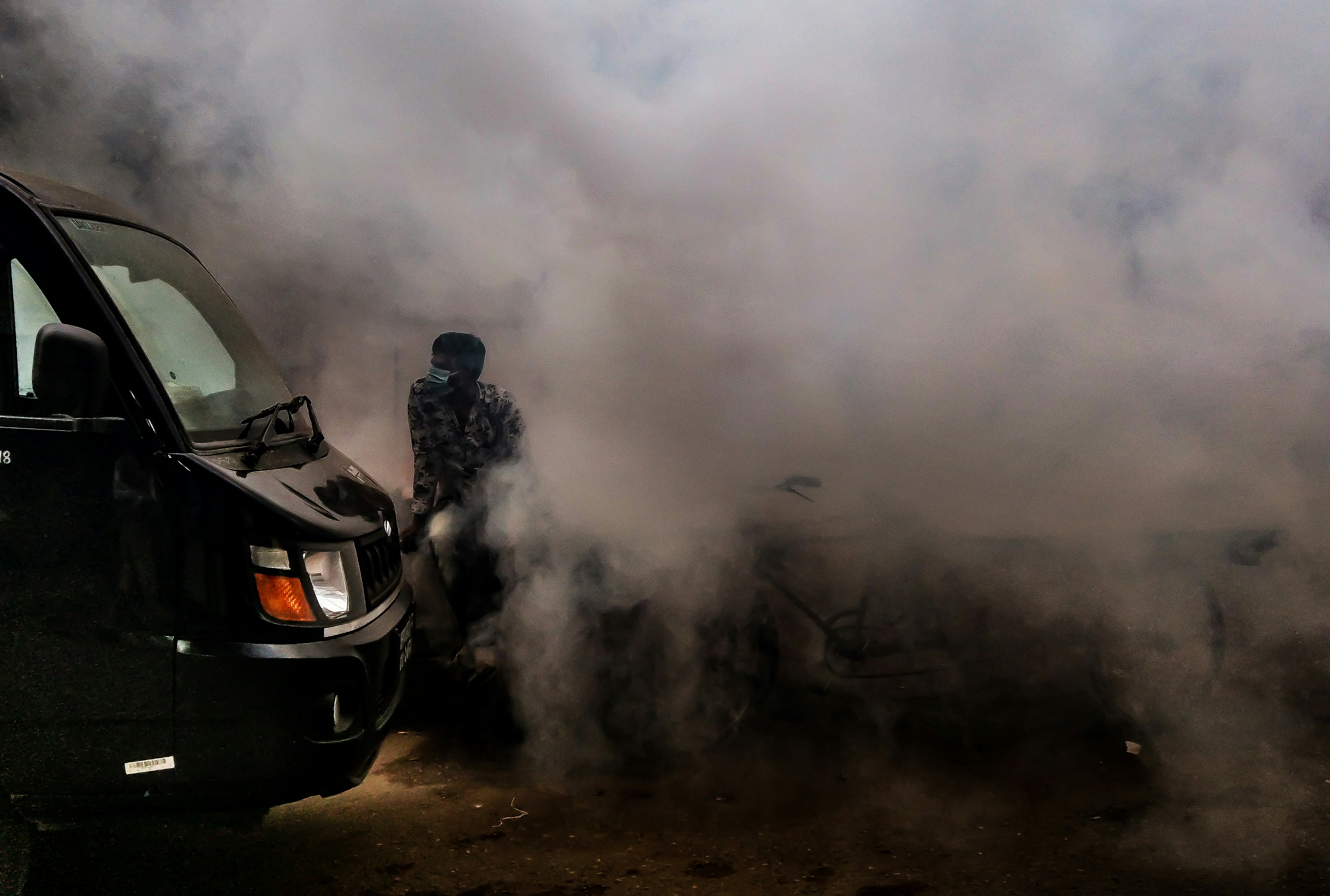 Smoke and Silence: A Corral of Dust, a Van, and a Lone Figure