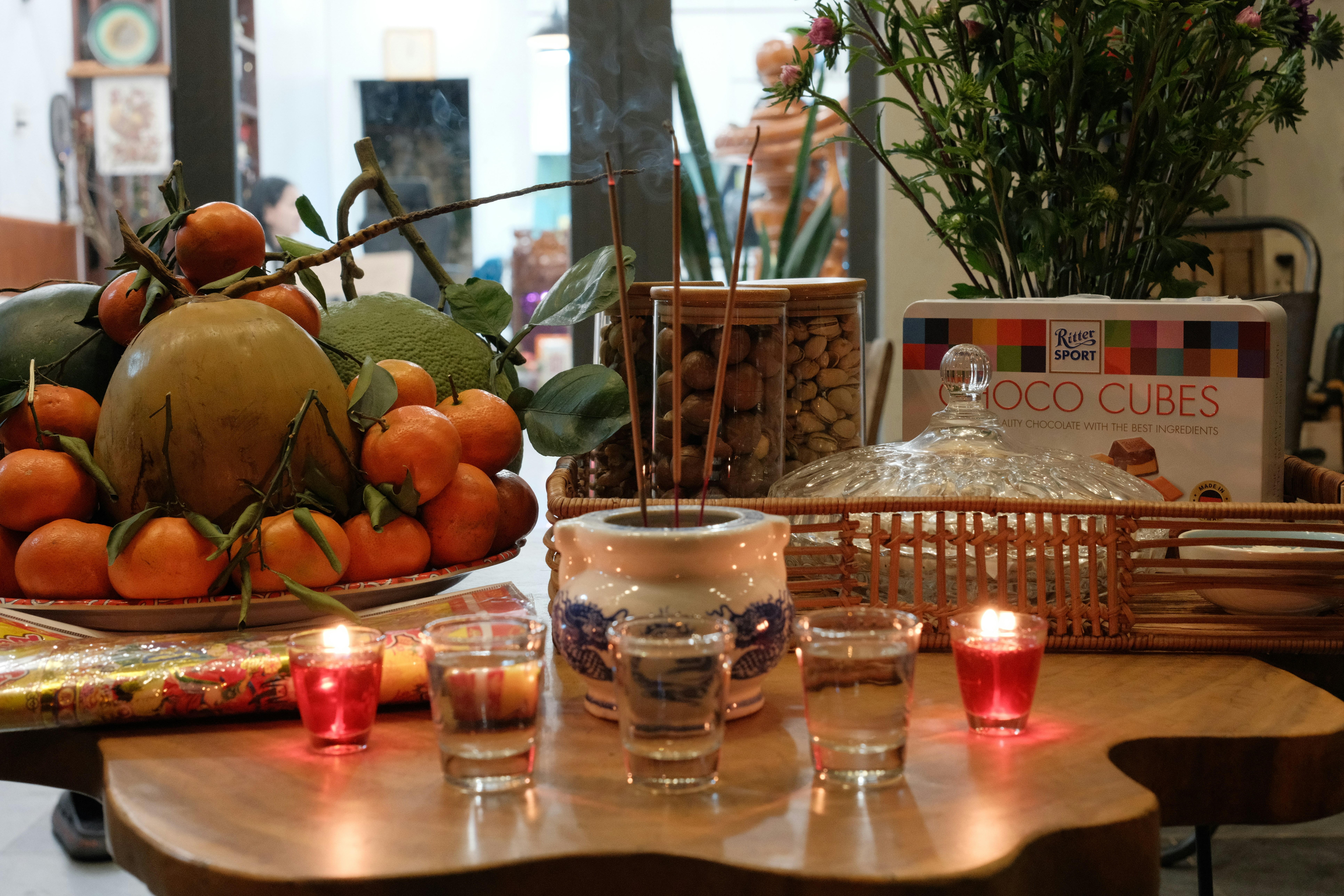 Blue-Patterned Ceramic Jar Centerpiece Amid Candlelight on a Rustic Table