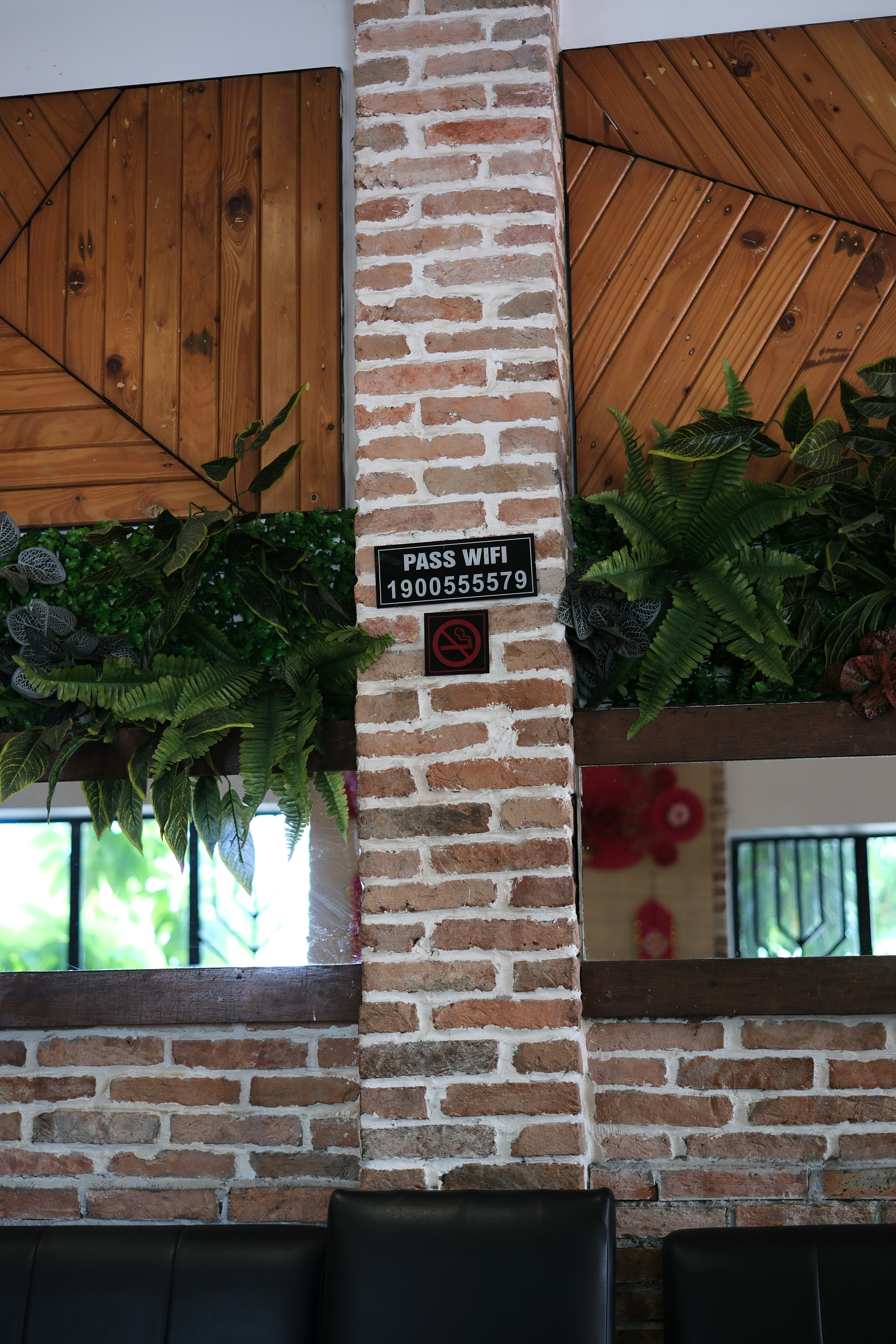 Brick Column Beacon: WiFi Sign Between Wood and Greenery