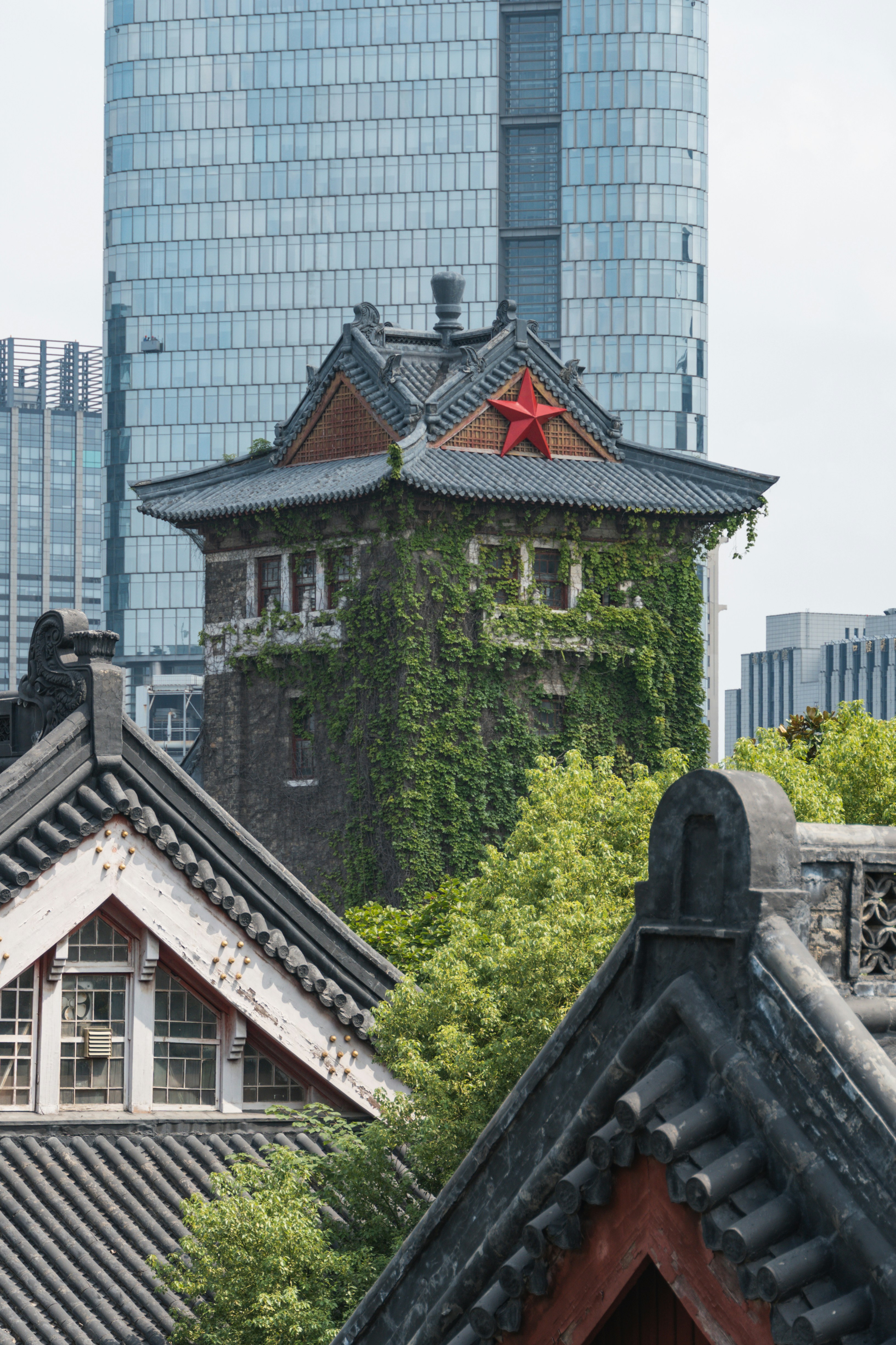 A tall building with a red star on top of it photo – Free Building ...
