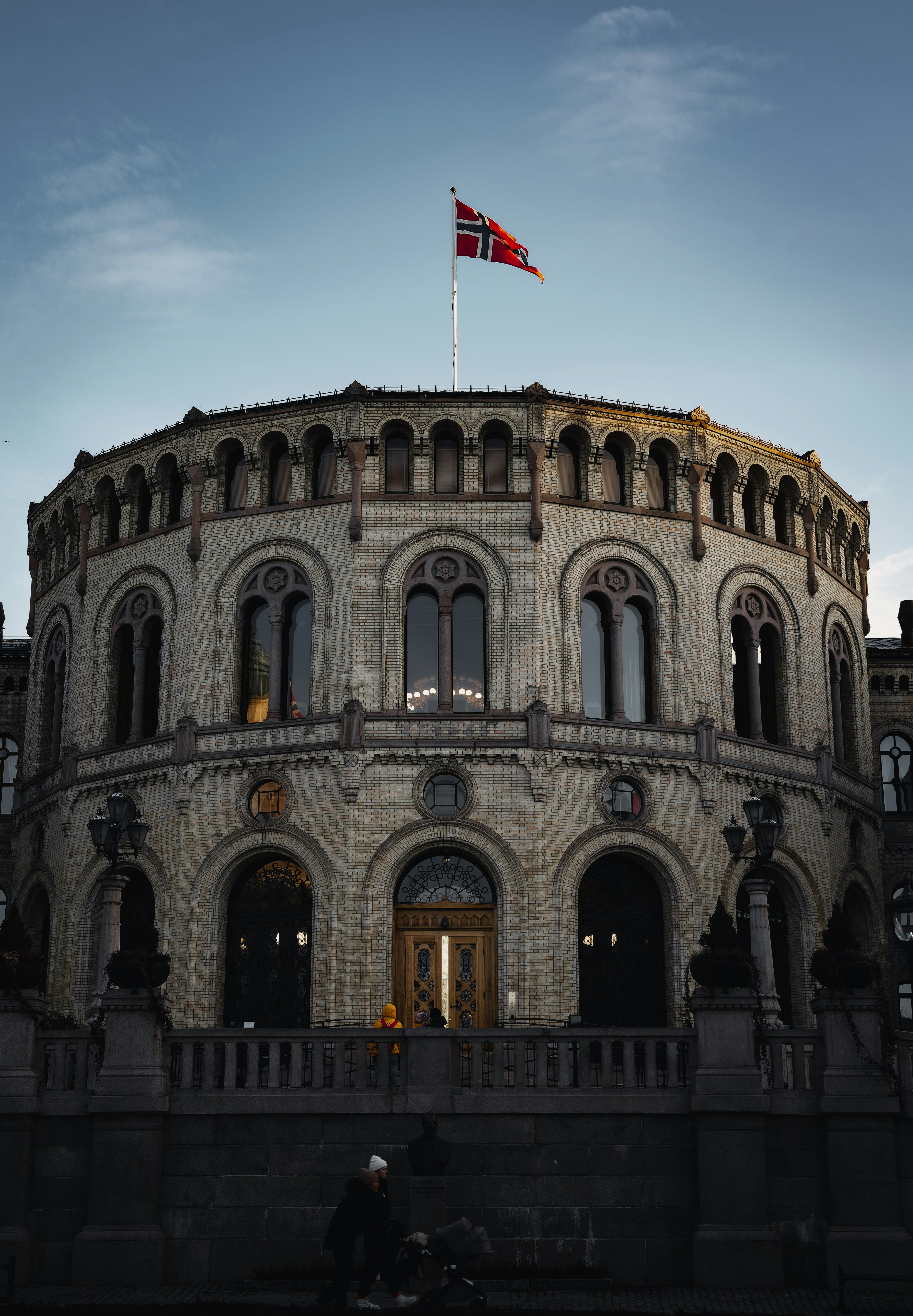 A large building with a flag on top of it photo – Free Wallpaper Image ...