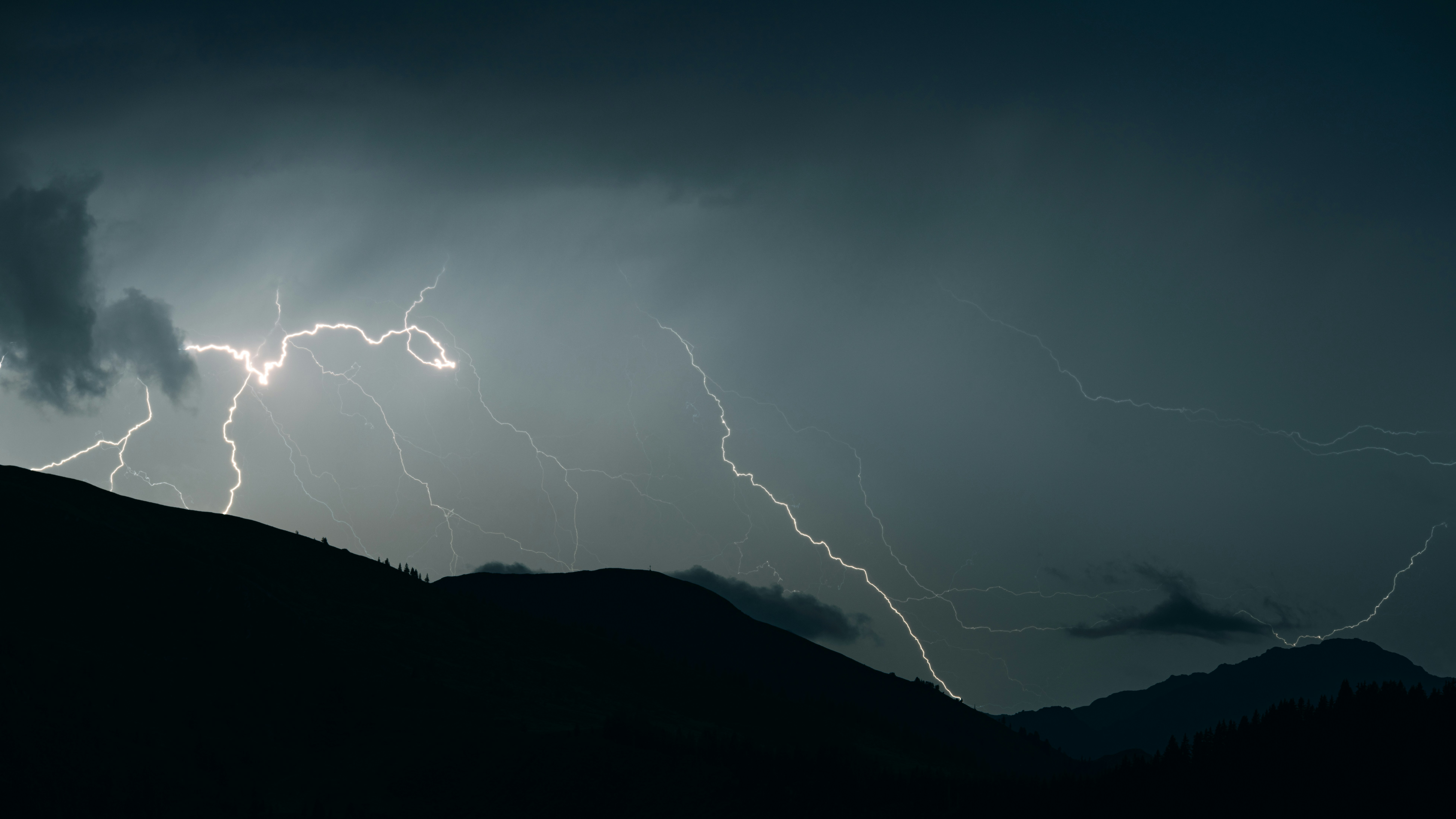 Veins of Light: Thunderstorm Over Peaks