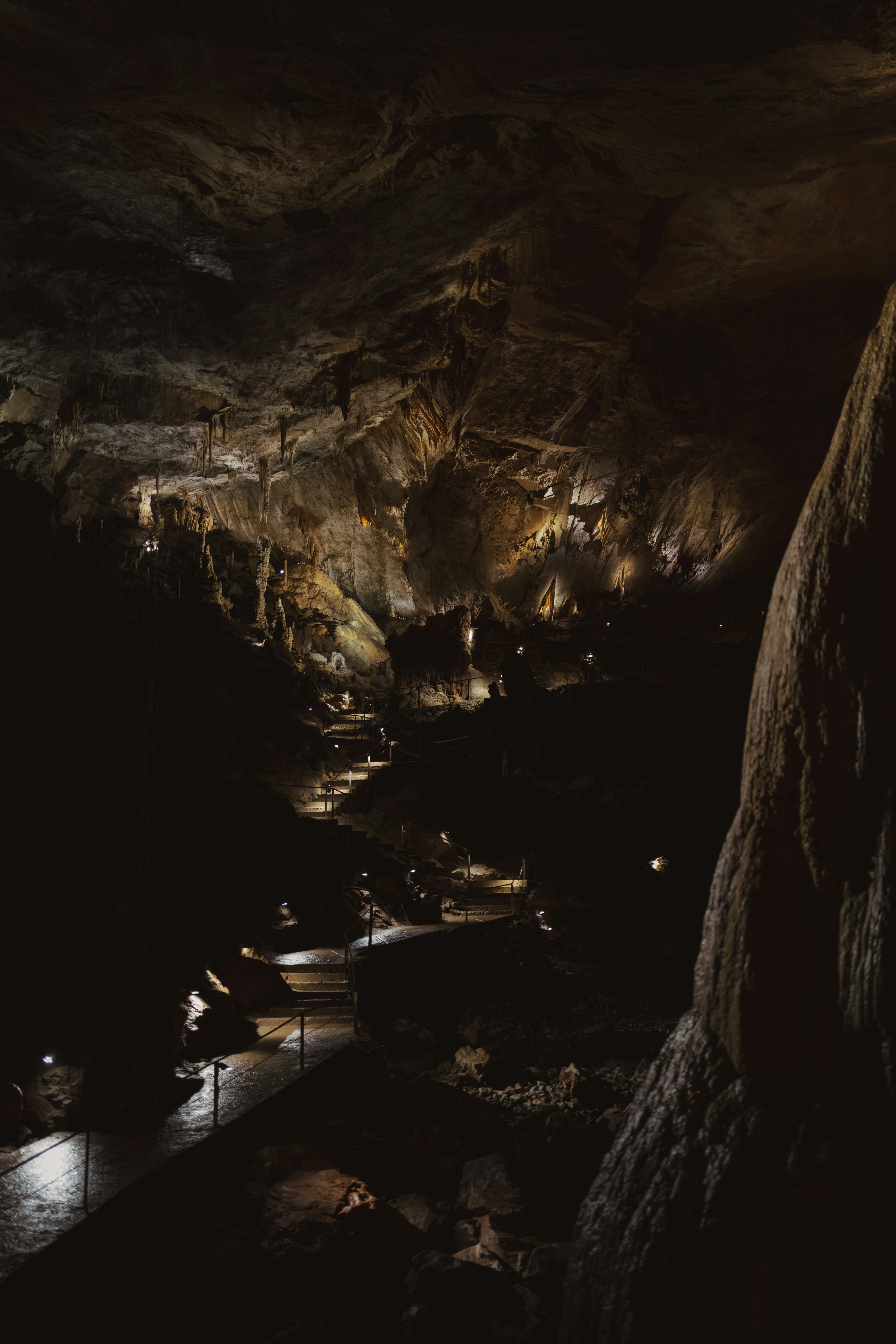 A cave filled with lots of cave like structures photo – Free Wallpaper ...