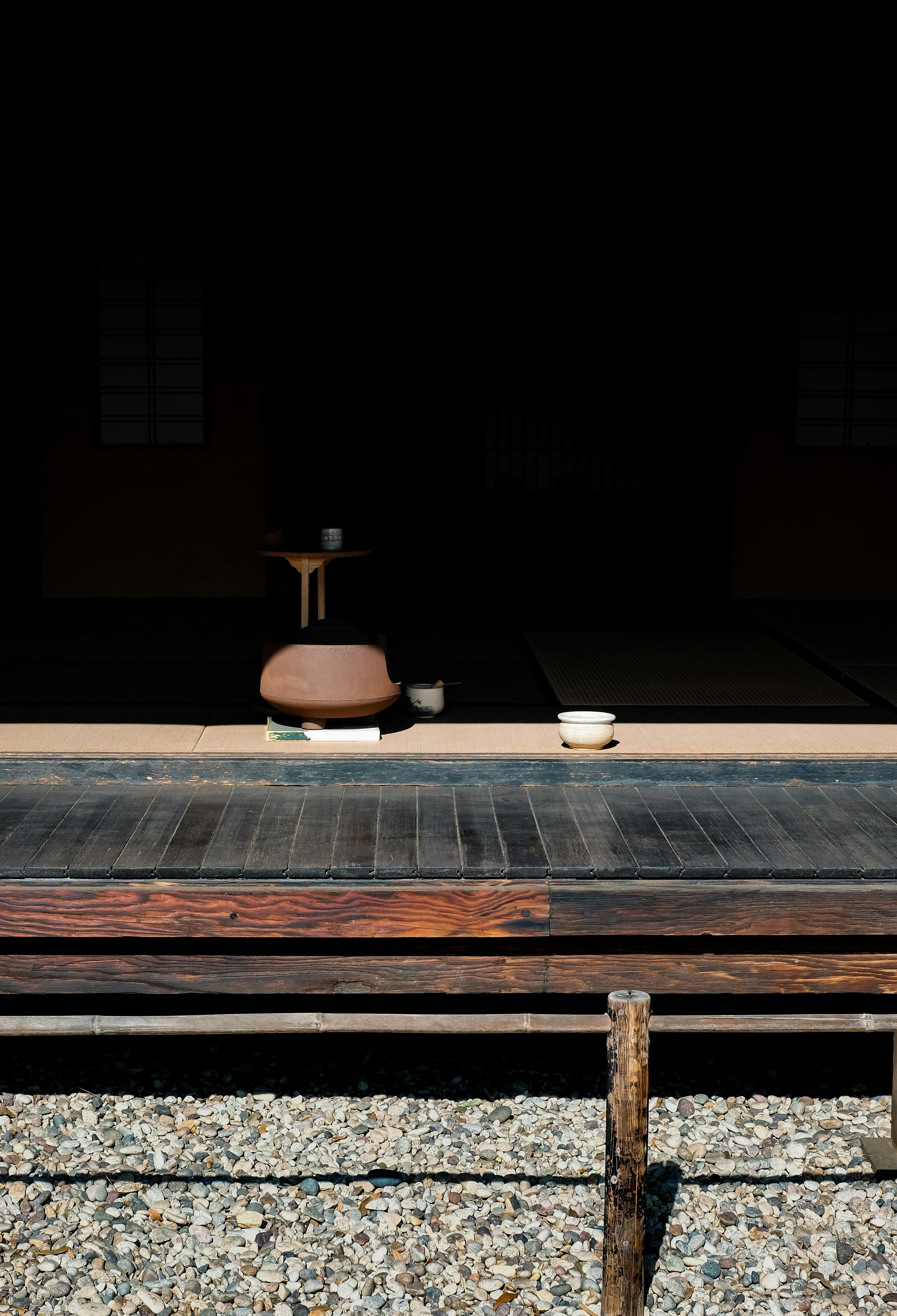 Whisper of Light on a Minimal Tea Table in a Dim Hall