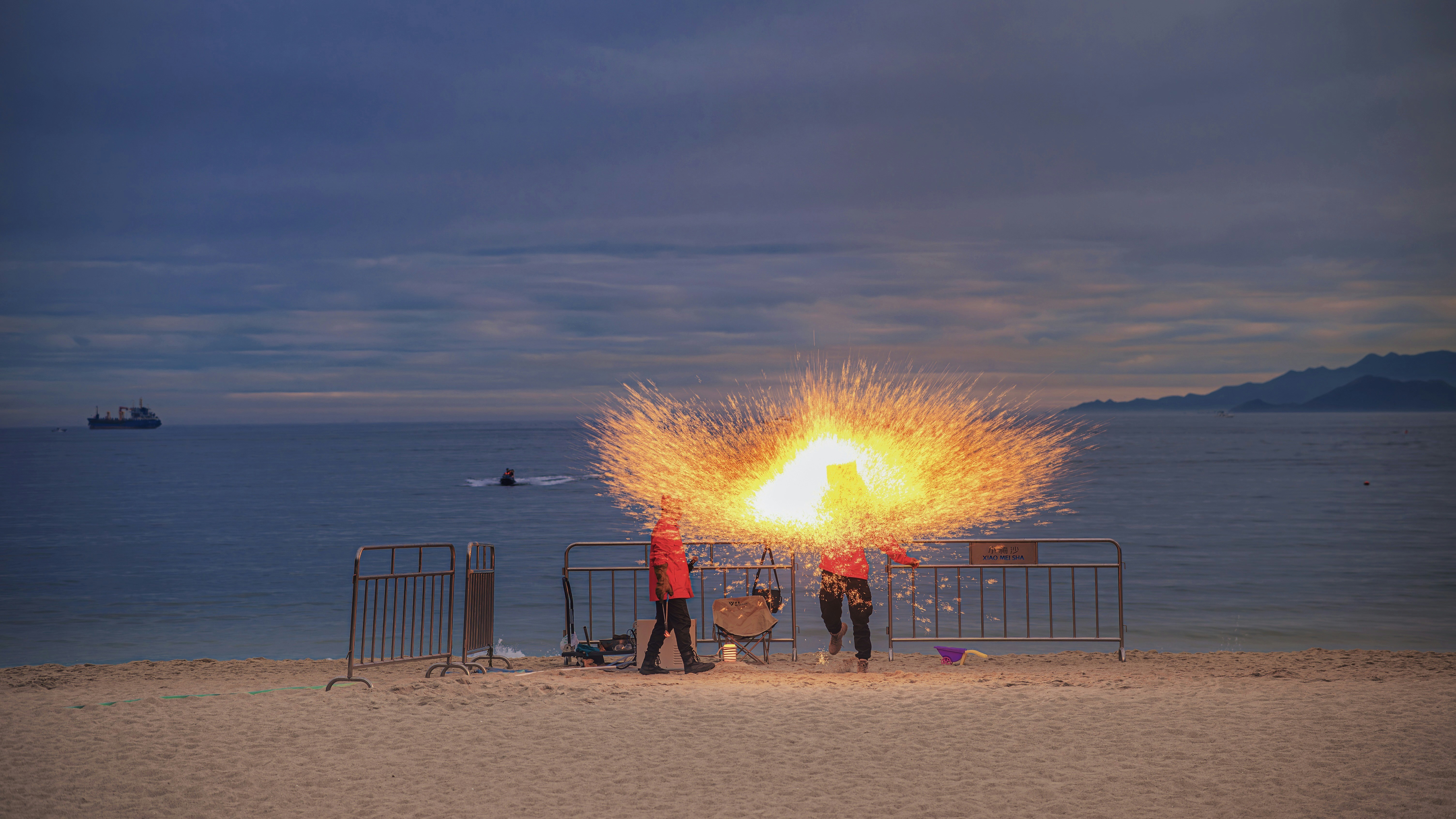 Sparks Over the Shore: Fire Curtain on a Calm Beach