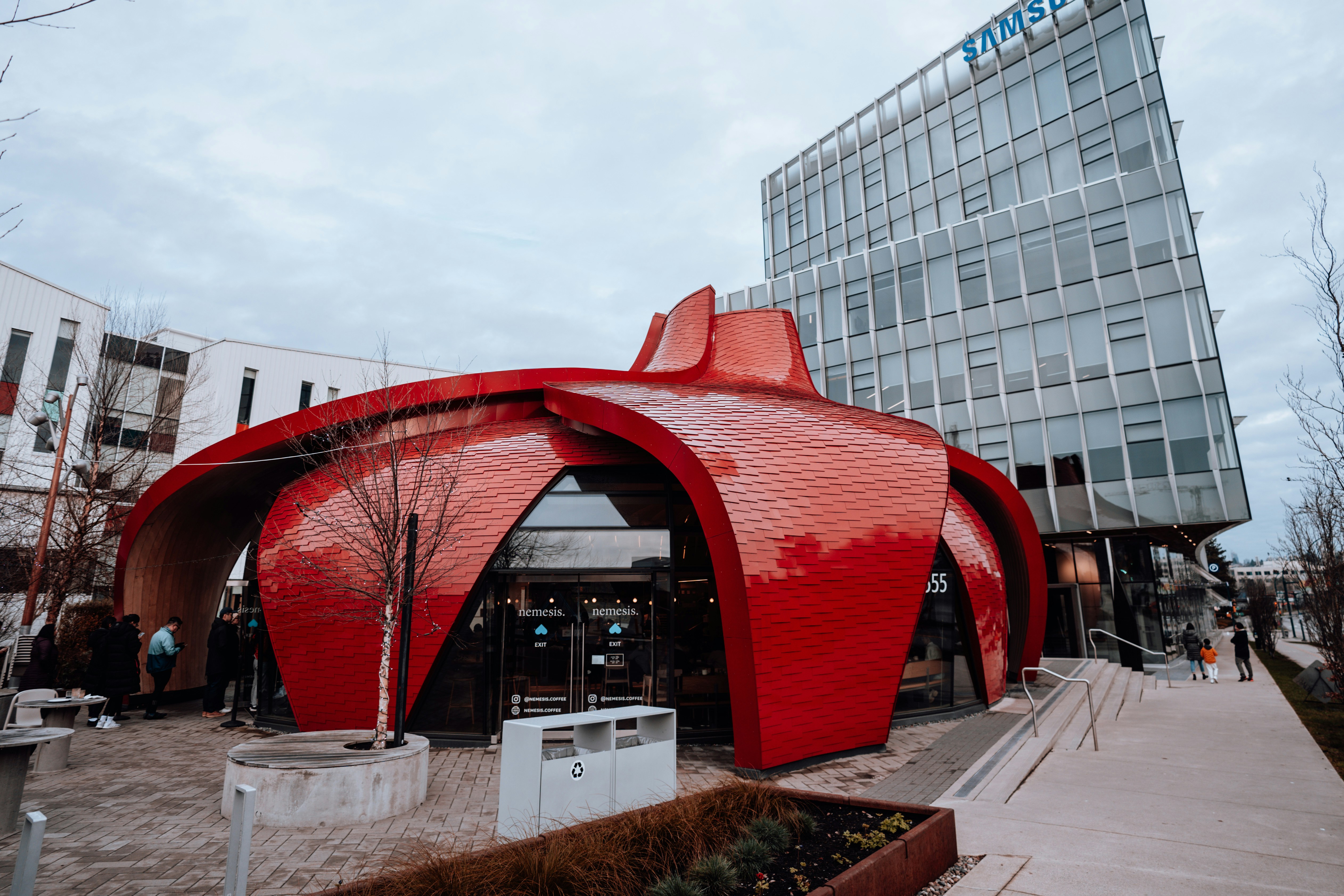 A large red building with a curved roof photo – Free Coffee Image on ...