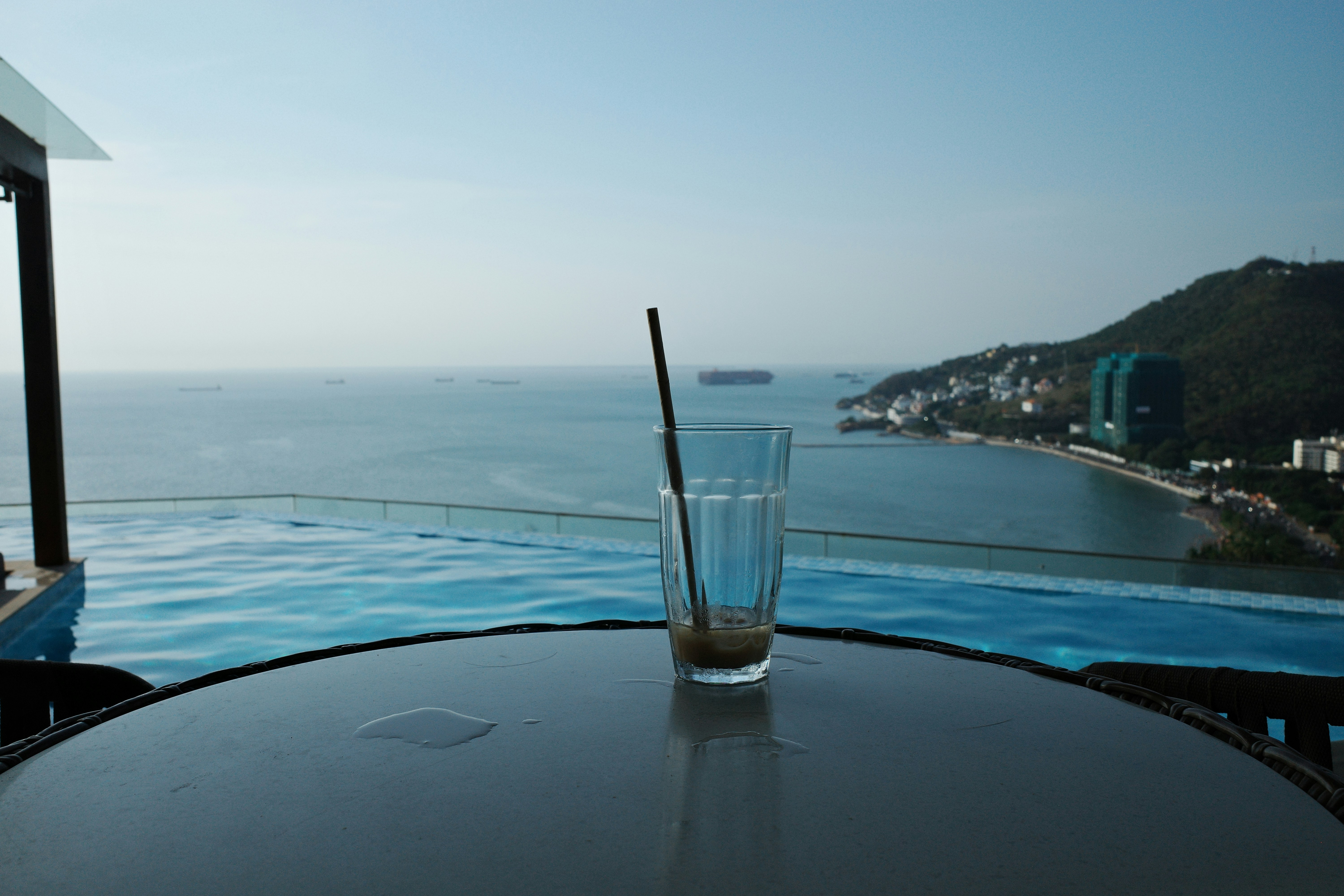 Glass at the Edge: Rooftop Infinity Pool with a Sea Horizon