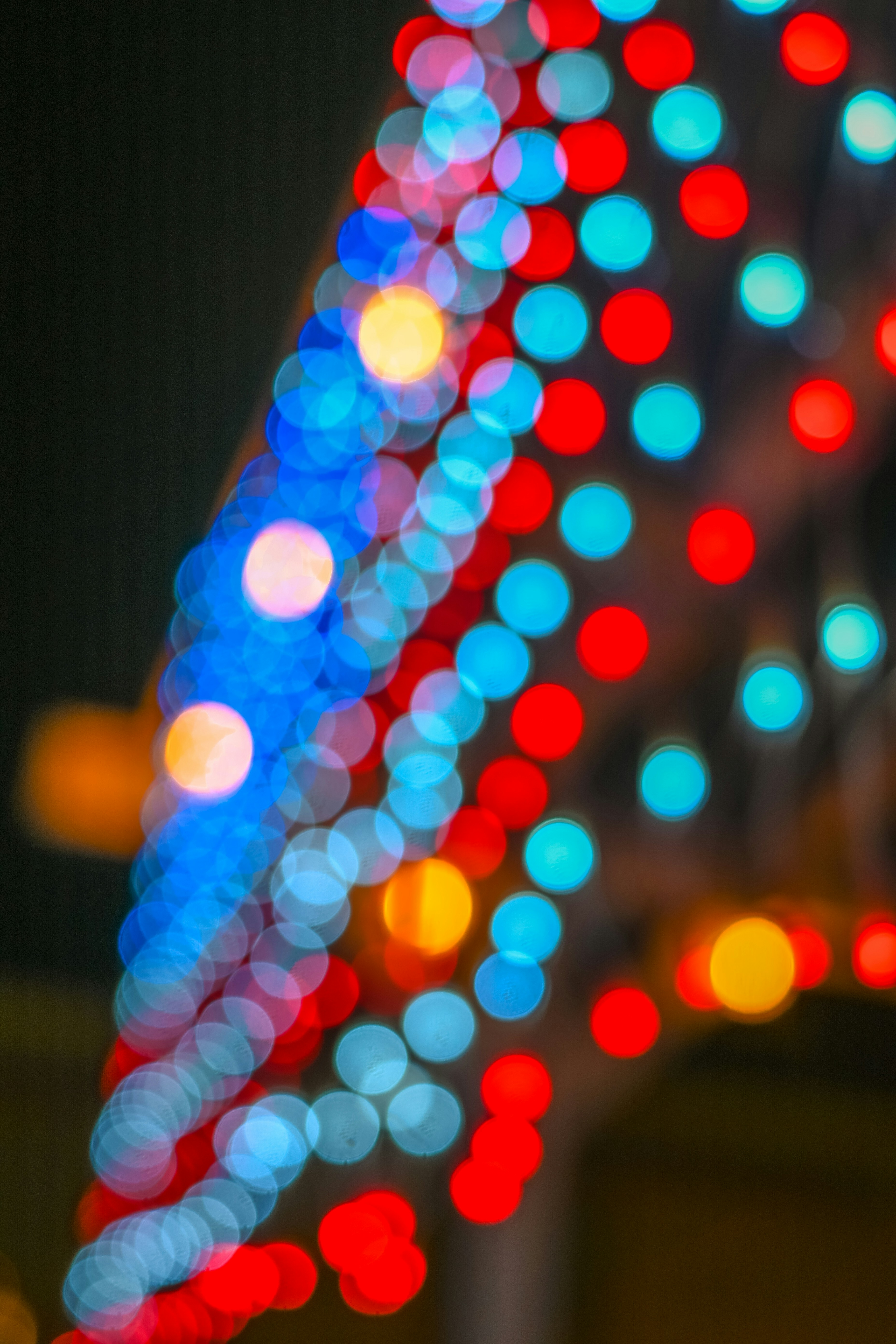 Neon Ribbons in Night Blur: A Diagonal Field of Bokeh
