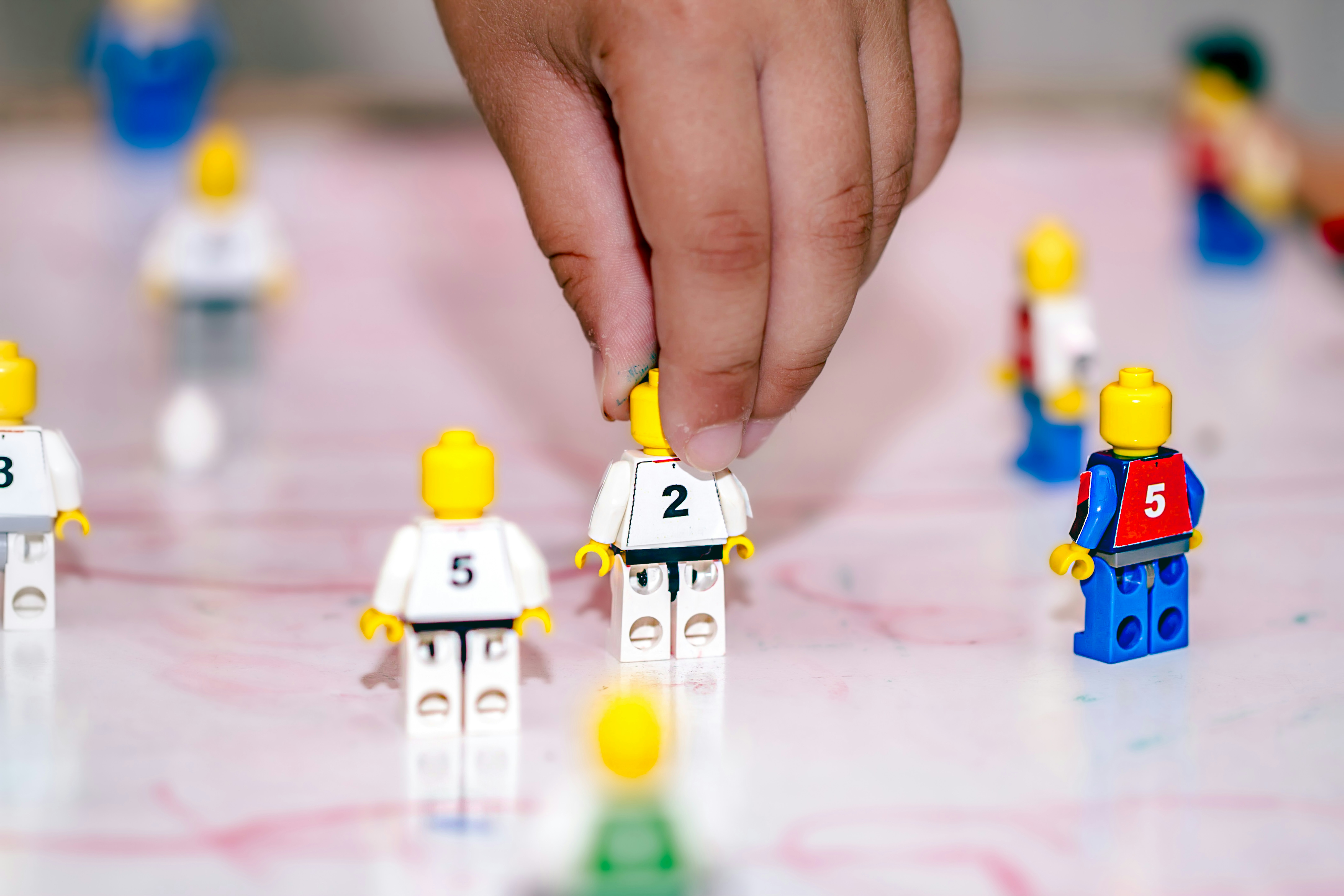 A person is playing a game of legos photo – Free Toy Image on Unsplash