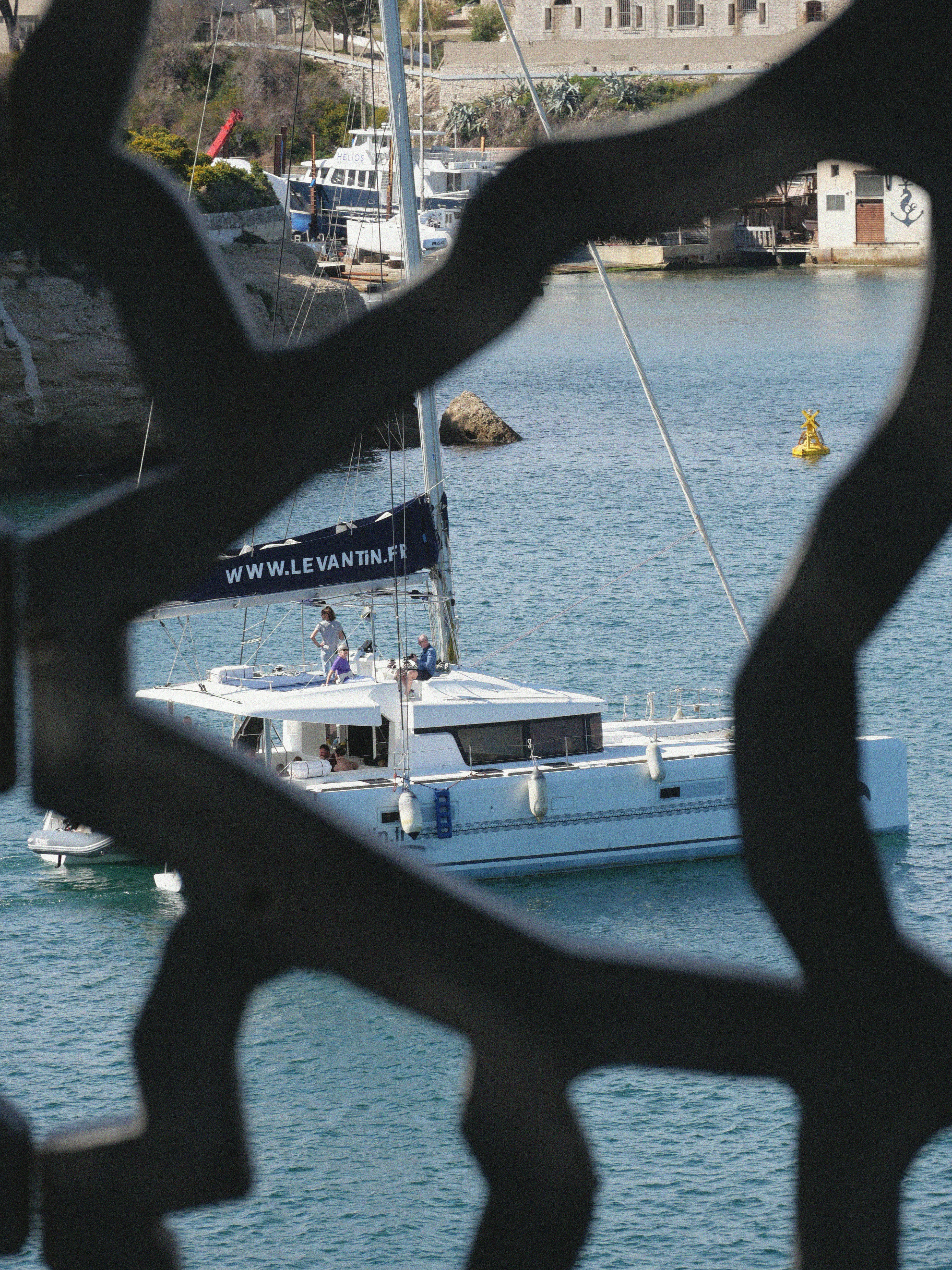 Harbor Scene Framed by Intricate Ironwork