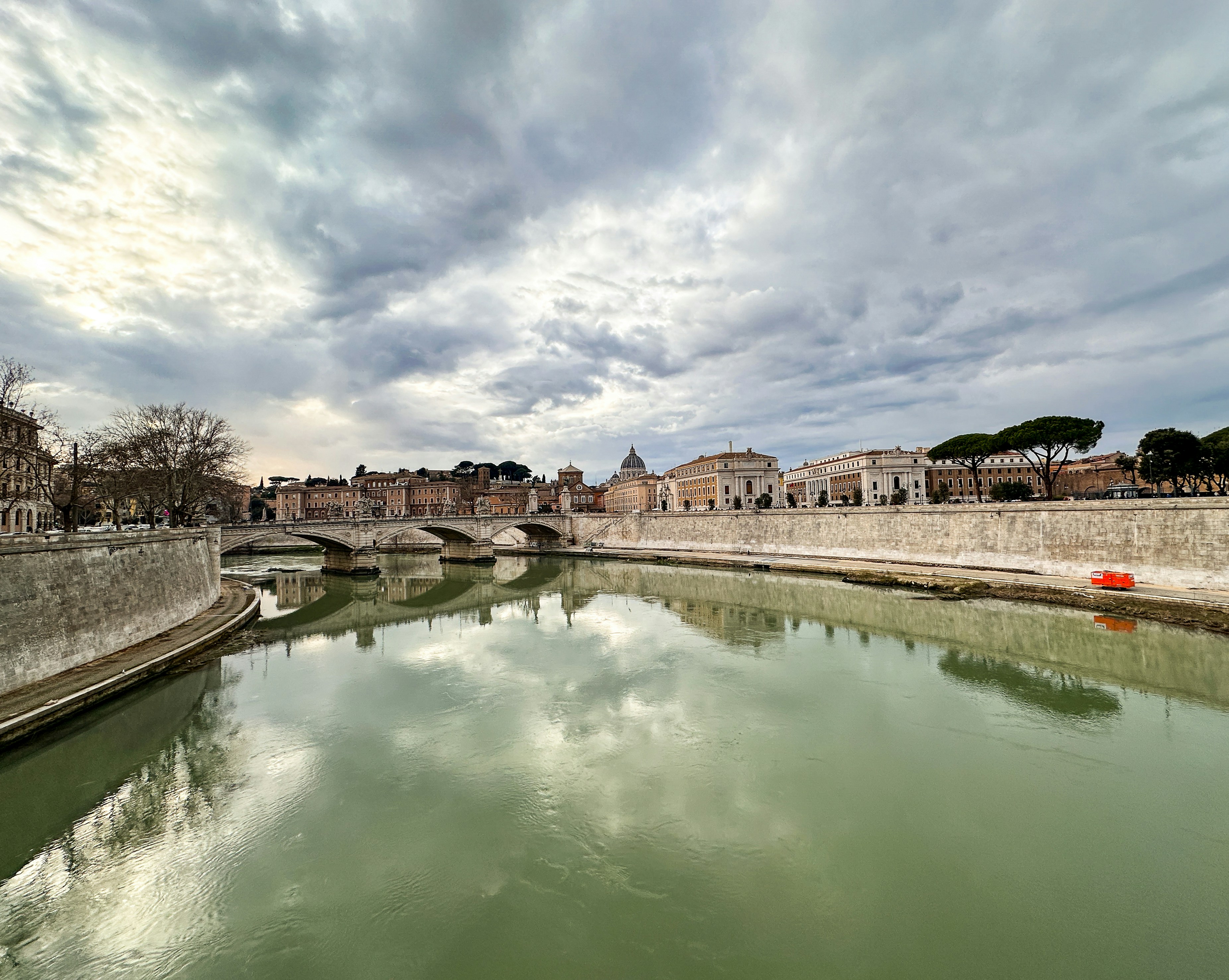 Arches, Reflections and a Red Boat: Rome on the Tiber