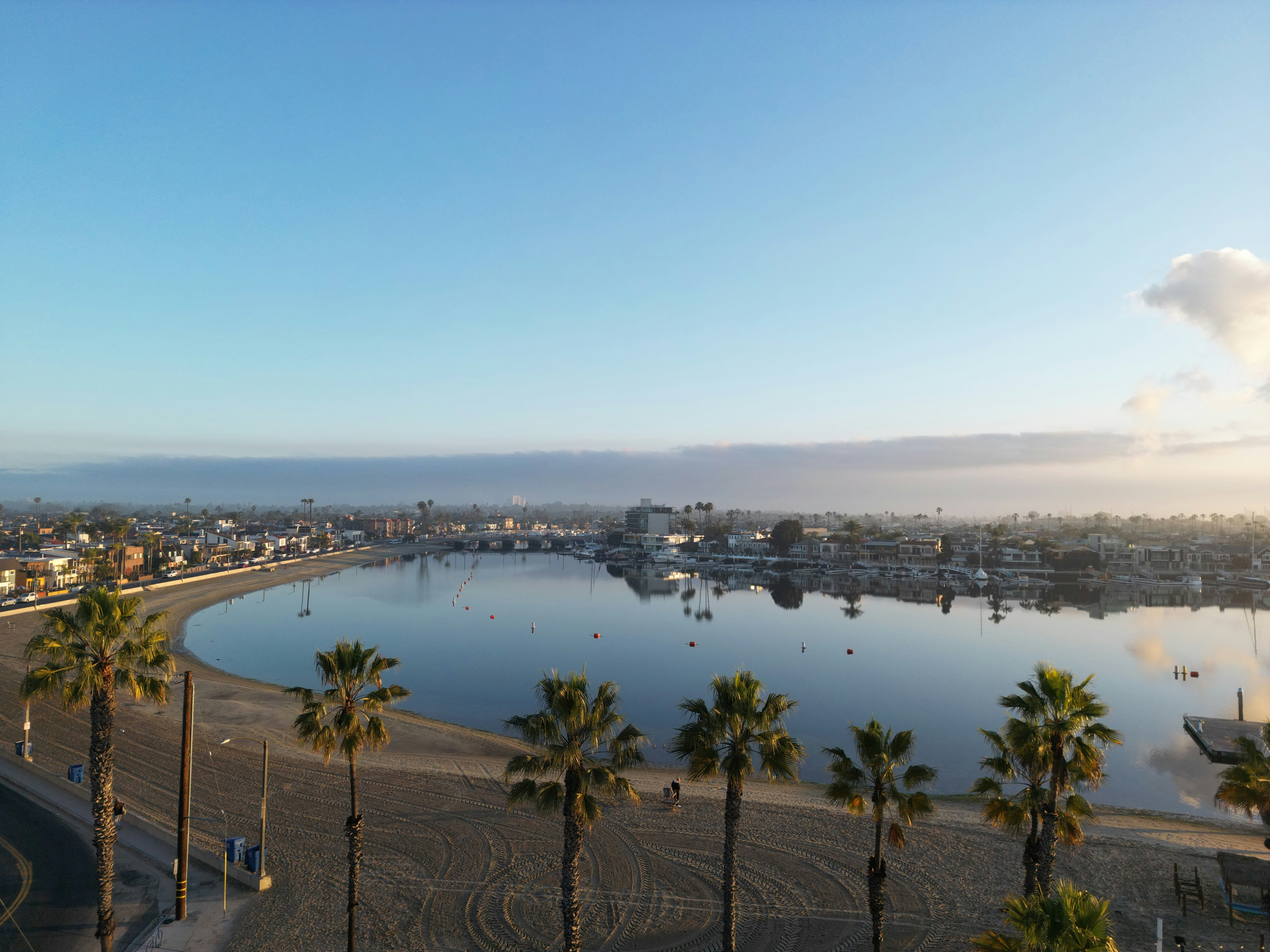 Morning Reflections Over Palm-Lined Lagoon