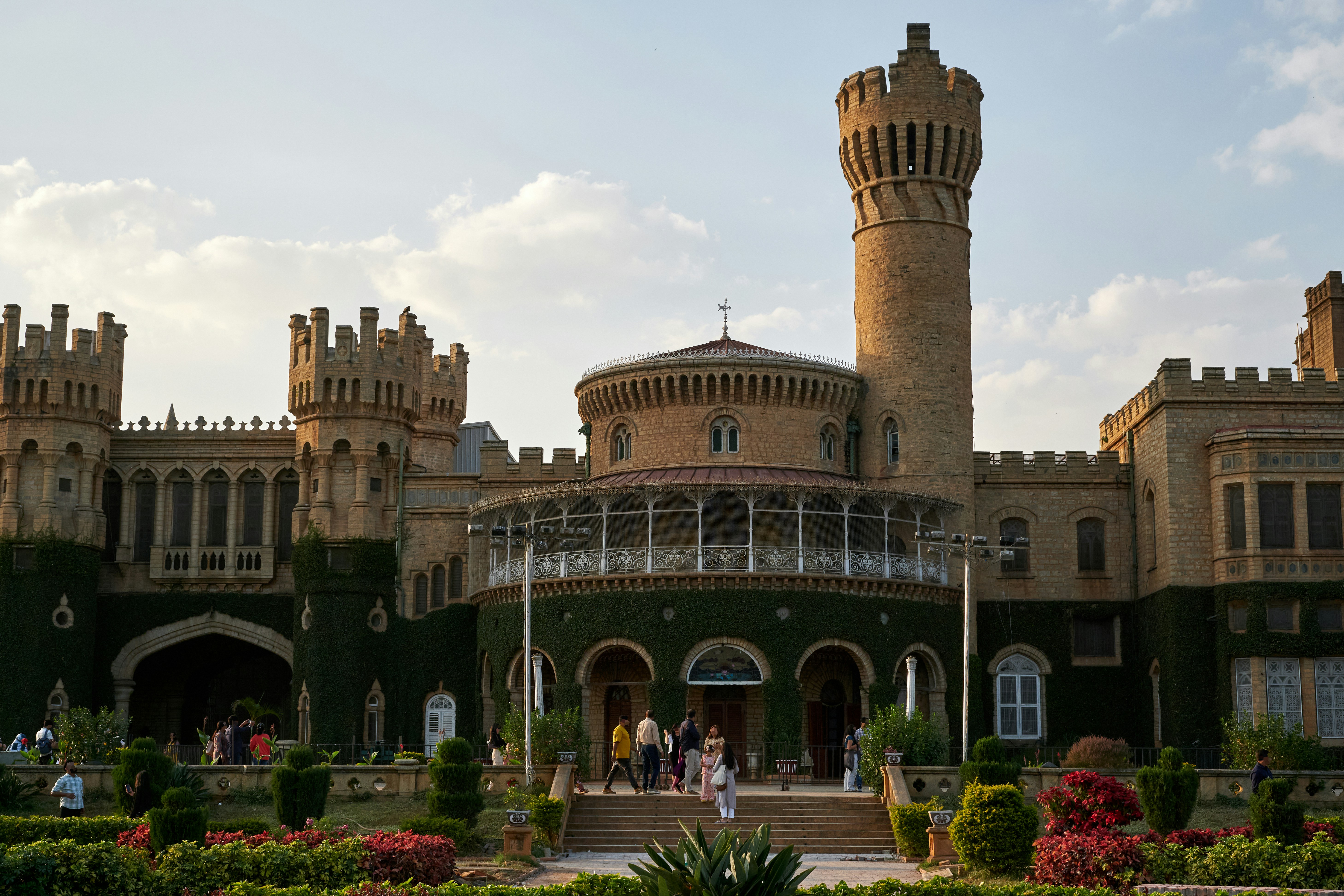 Sunlit Castle Courtyard: Turrets Framing a Circular Central Wing