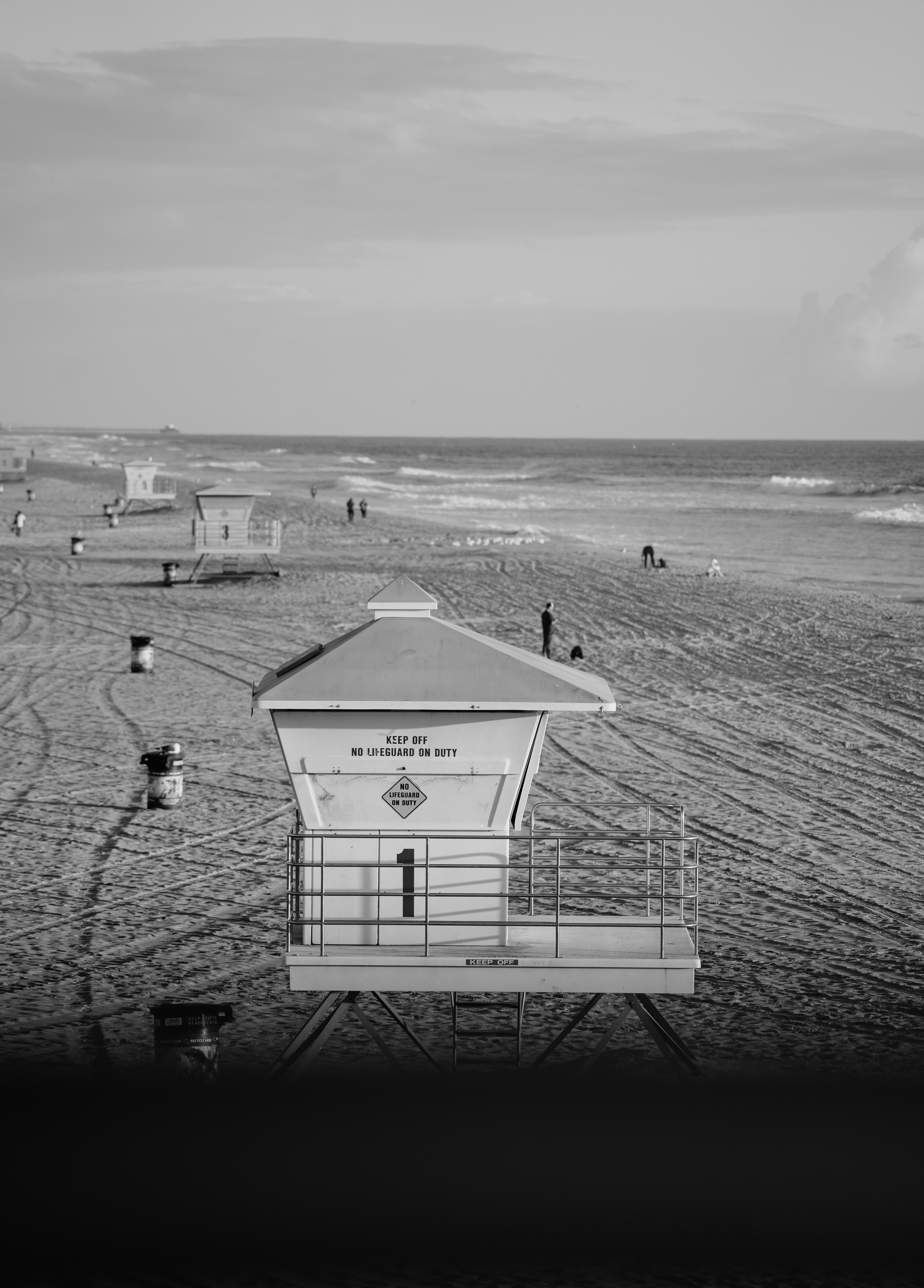 Gray Sentinel over a Quiet Beach