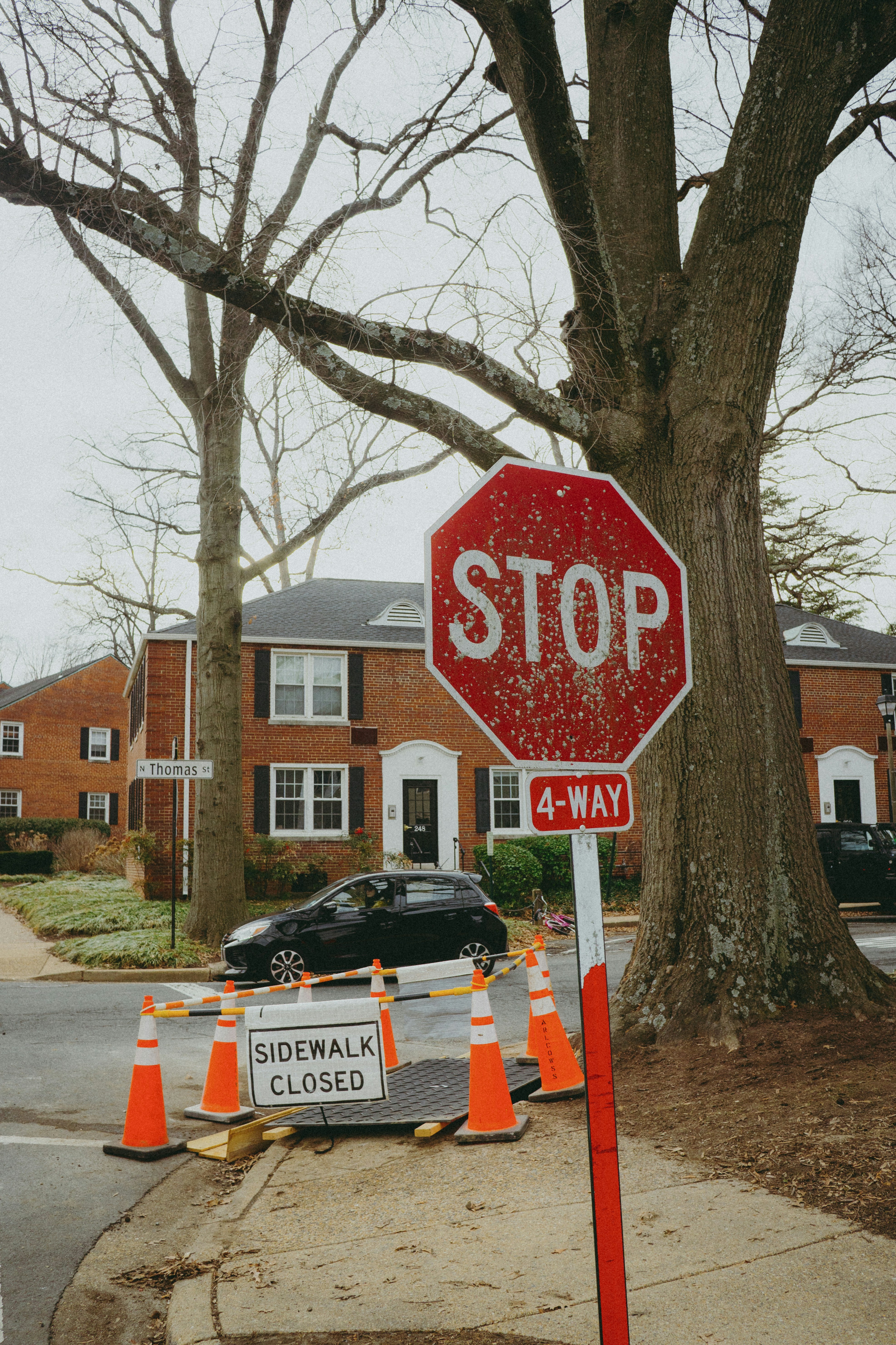 Stop Sign Sentinel by a Closed Sidewalk on a Suburban Corner