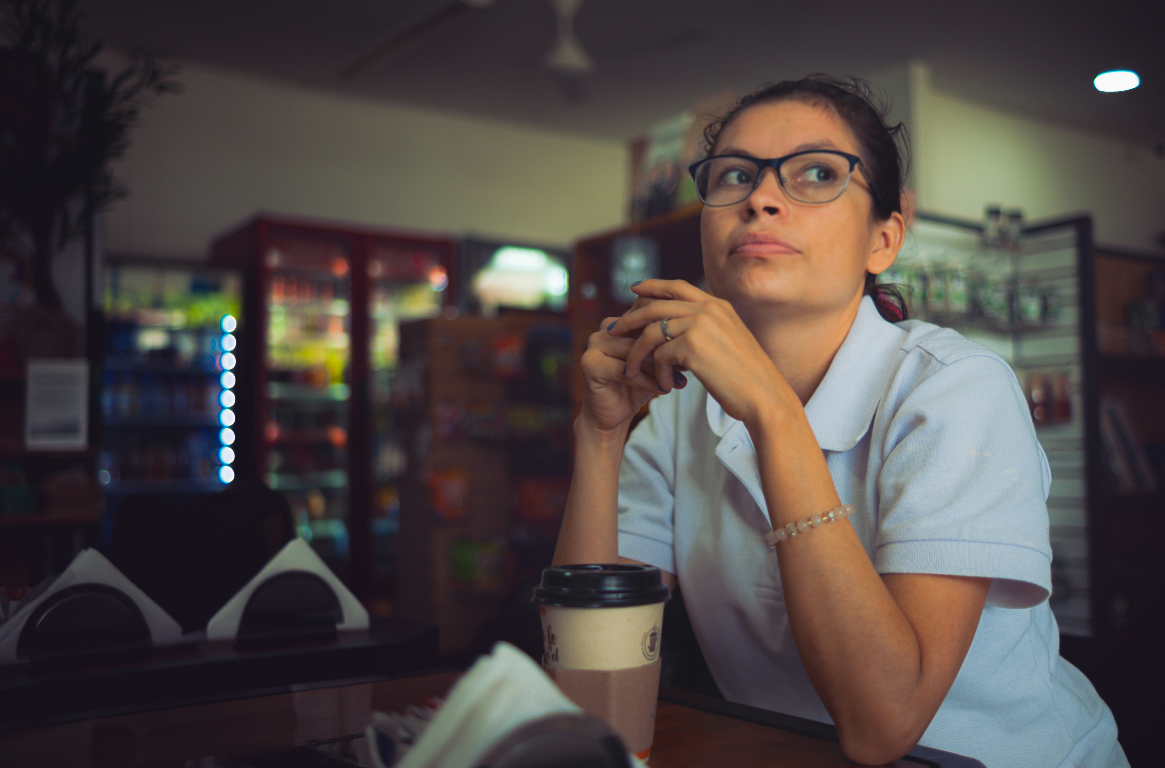 Contemplation at the Counter: A Quiet Café Portrait