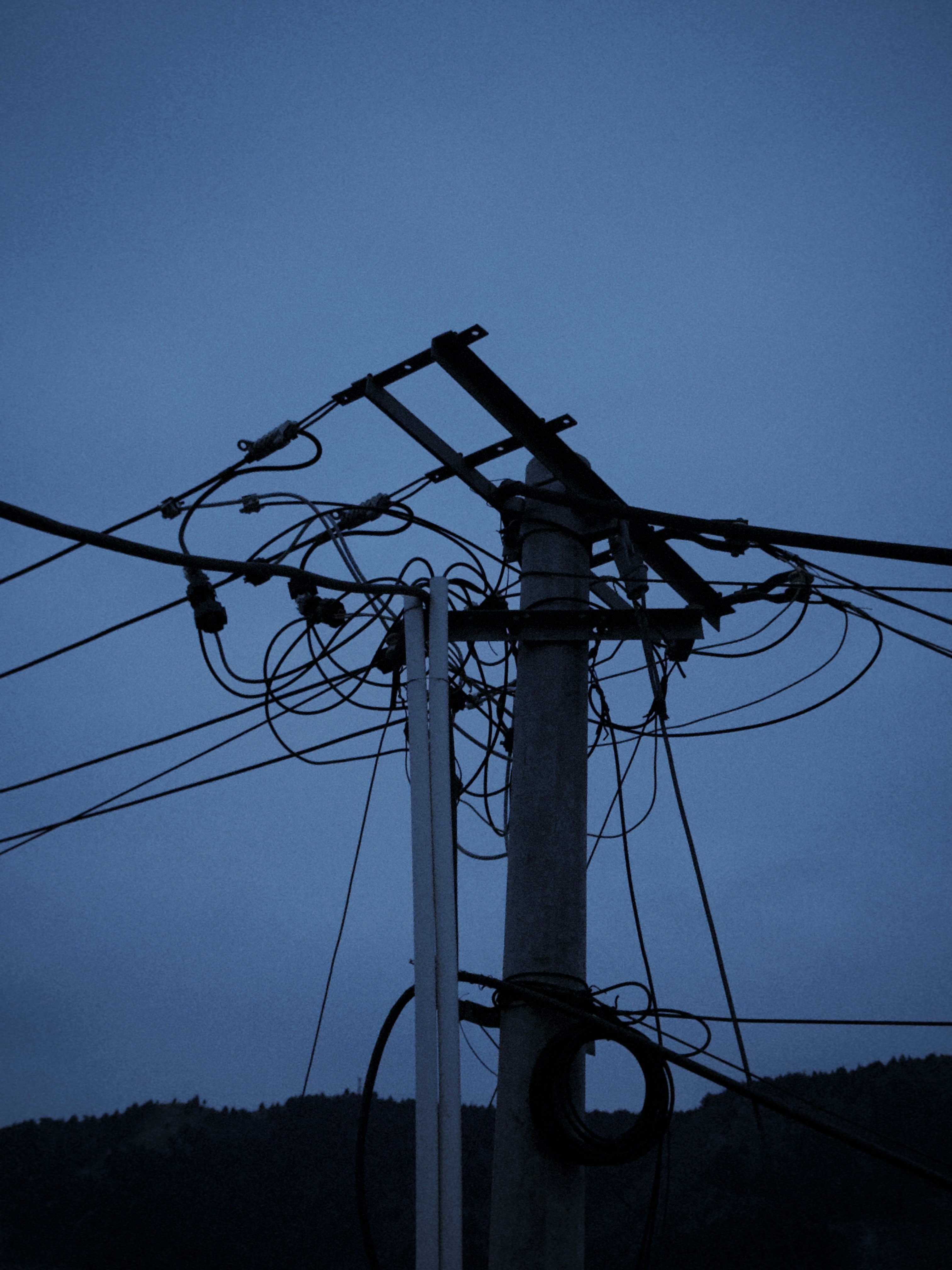 A telephone pole with wires and wires attached to it photo – Free ...