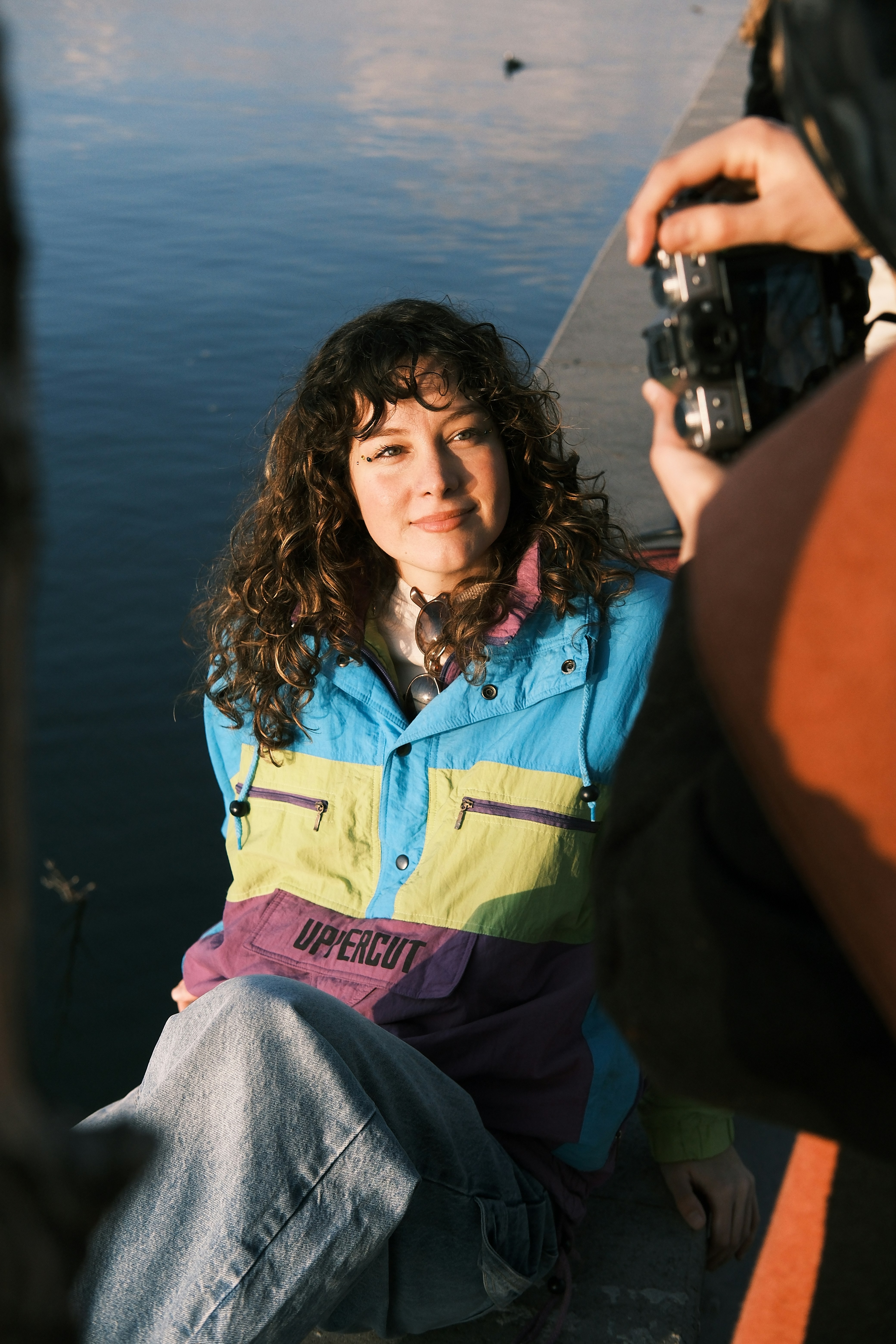 Dockside Portrait: Neon Jacket in Soft Light by Calm Waters