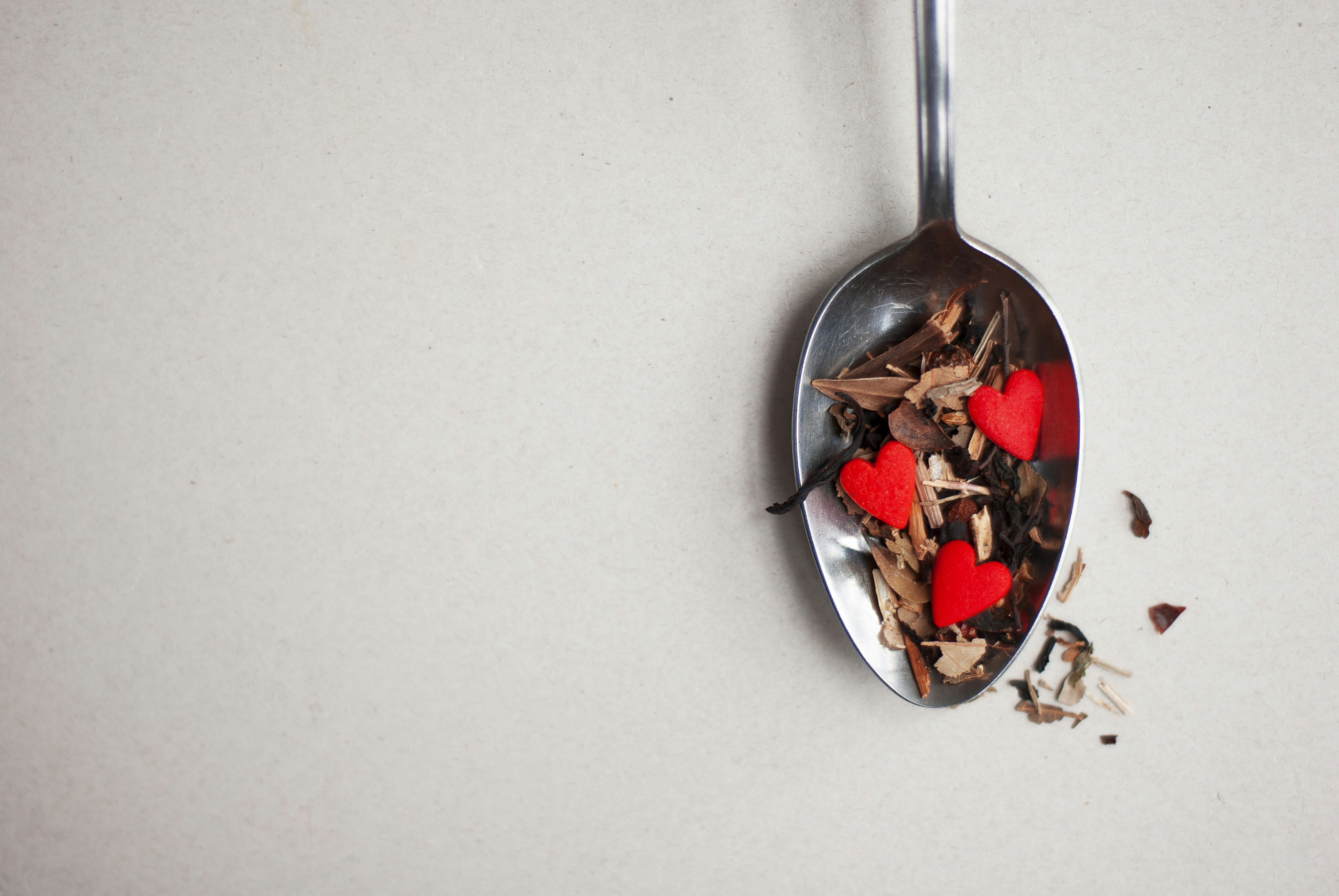 Spoonsful of Red: Hearts and Cocoa Shavings in a Quiet Spill