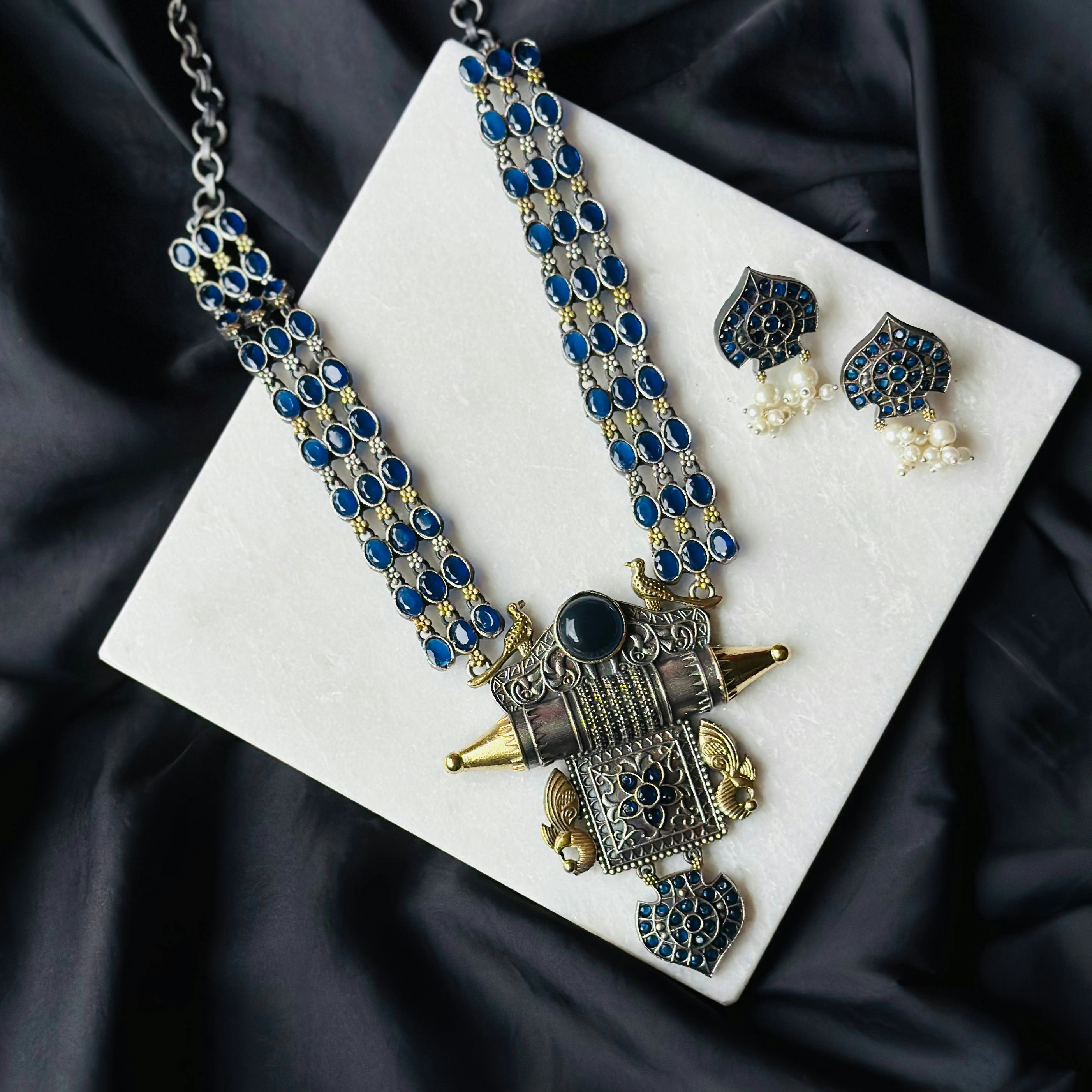 Discover Cherriscope's handcrafted dual-tone elephant necklace, blending polished and oxidized silver finishes. This elegant piece symbolizes strength and wisdom, adding cultural sophistication to your jewelry collection.