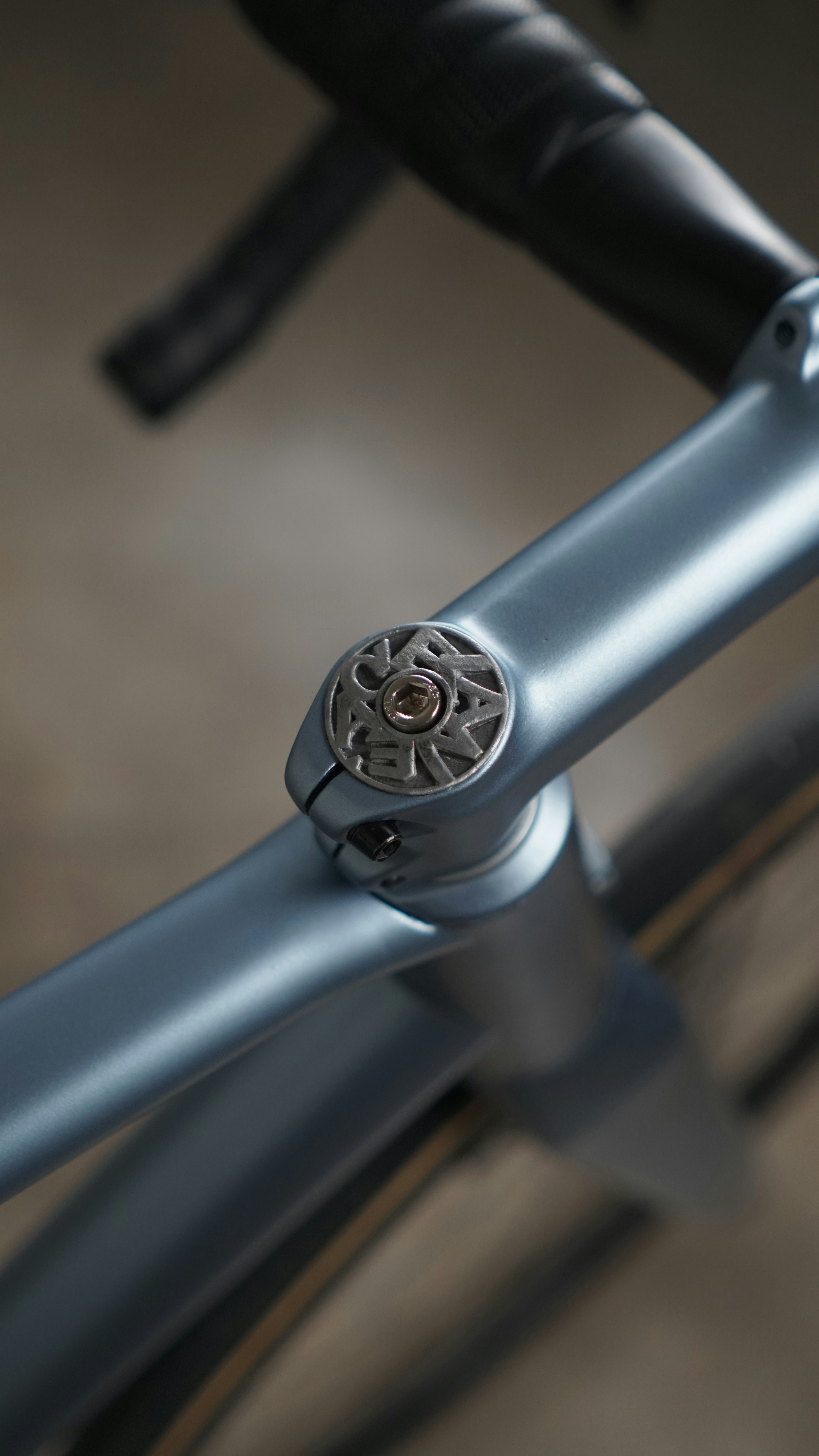 Pivot Point: A Close-Up of Bike Stem Hardware in Soft Light
