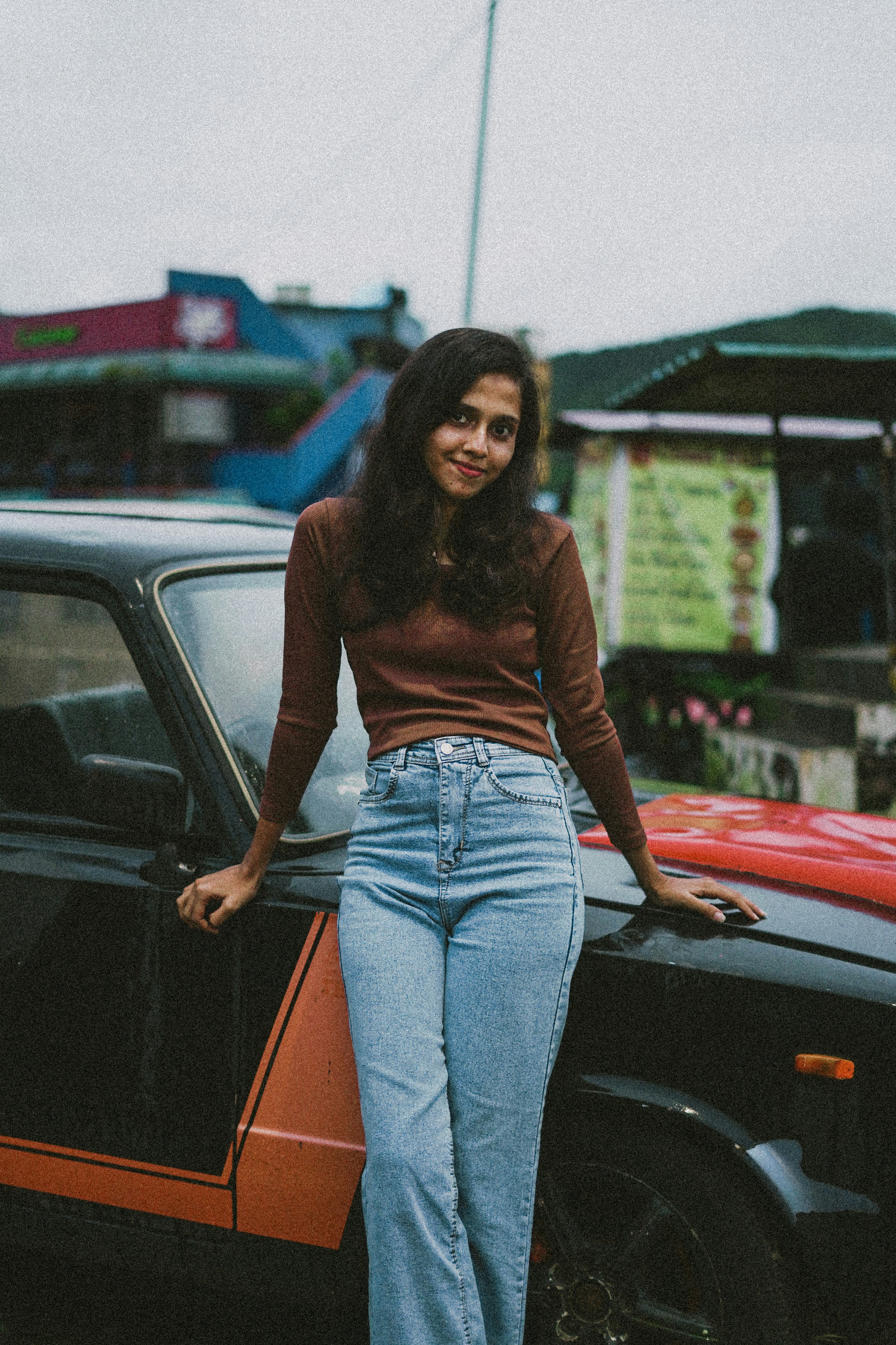 Cityscape Casual: A Moment with the Car and Confident Smile