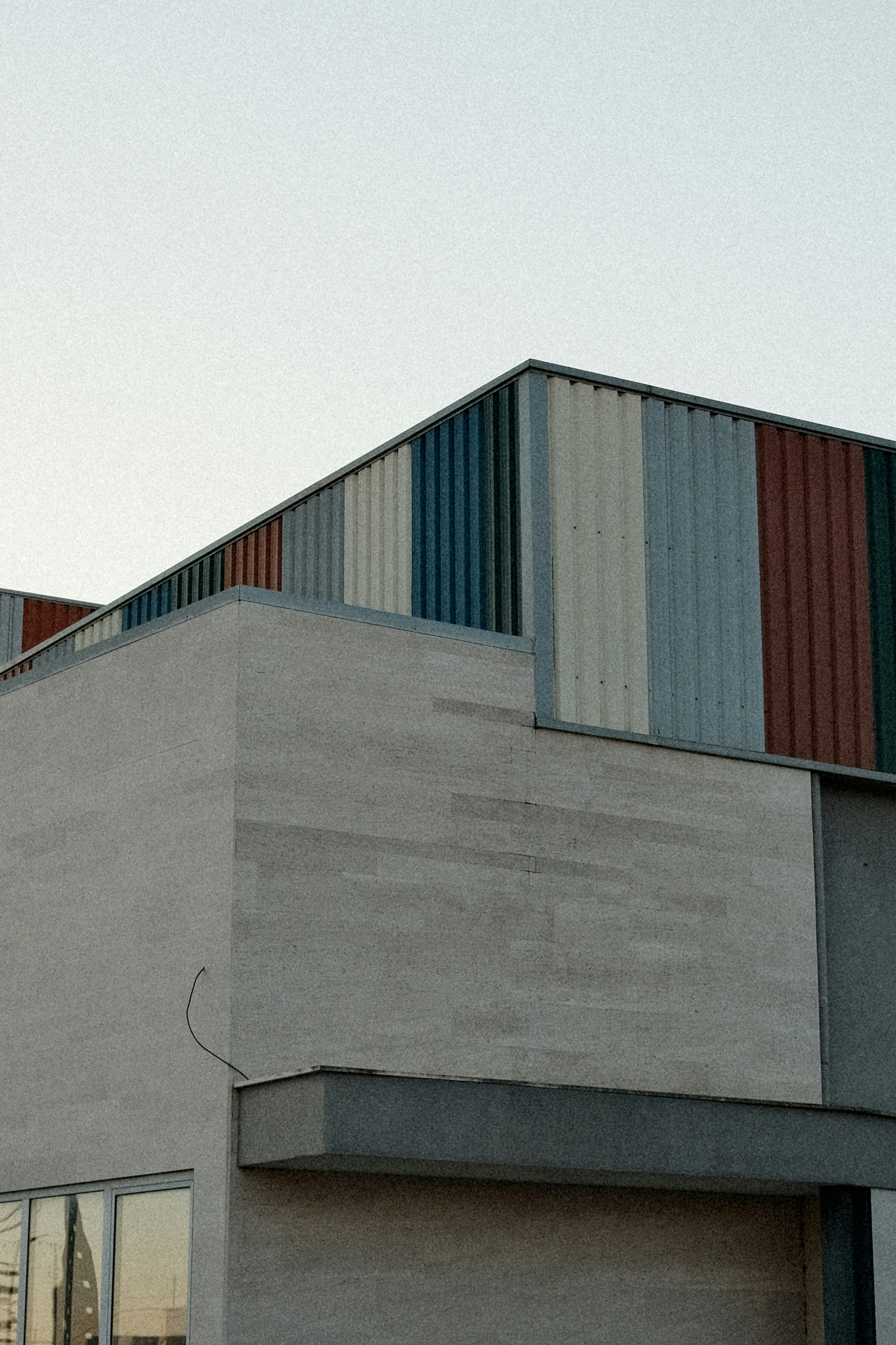 Pastel Stripes and Concrete: A Minimalist Urban Corner