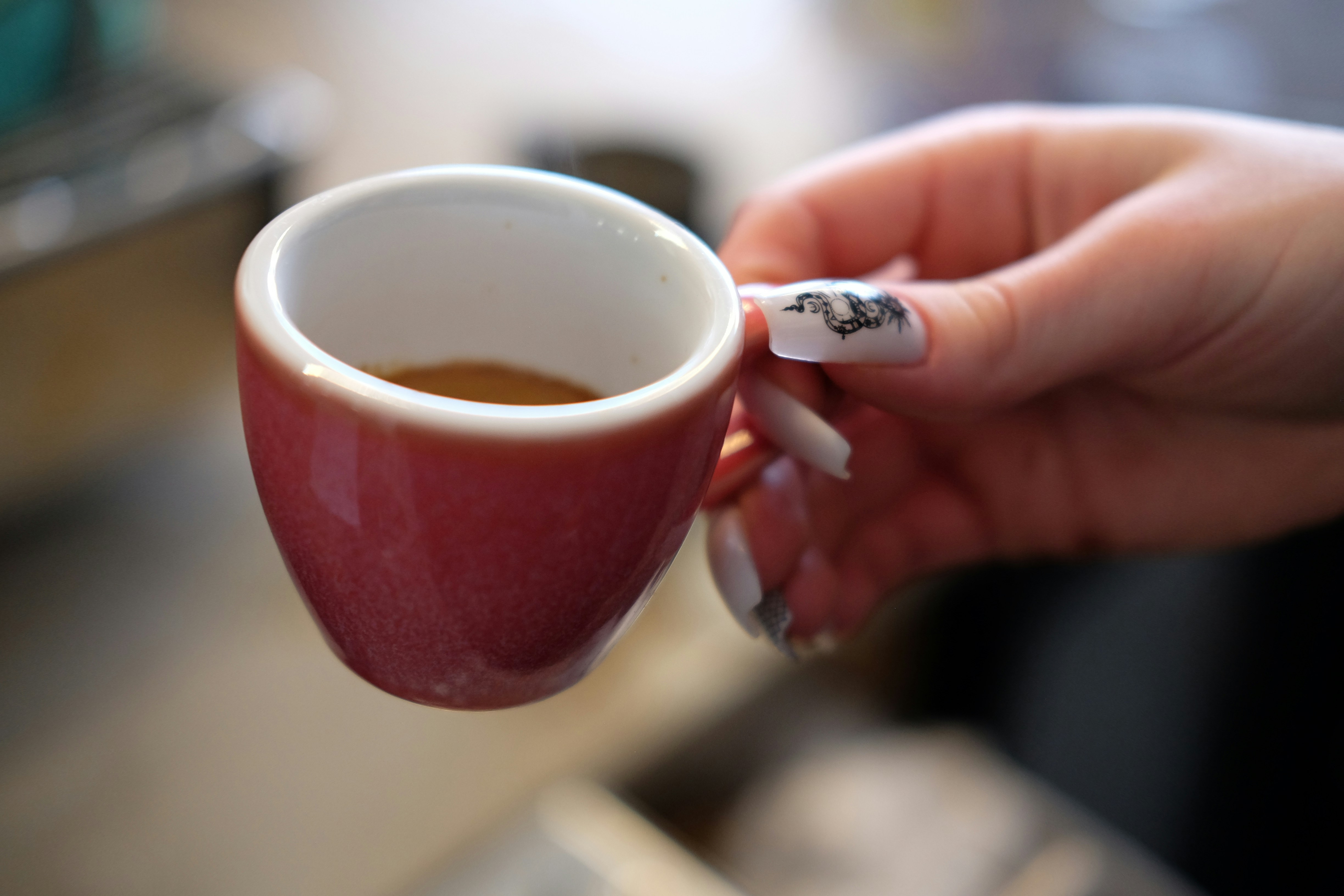Crimson Cup in Focus: A Delicate Handoff of Espresso
