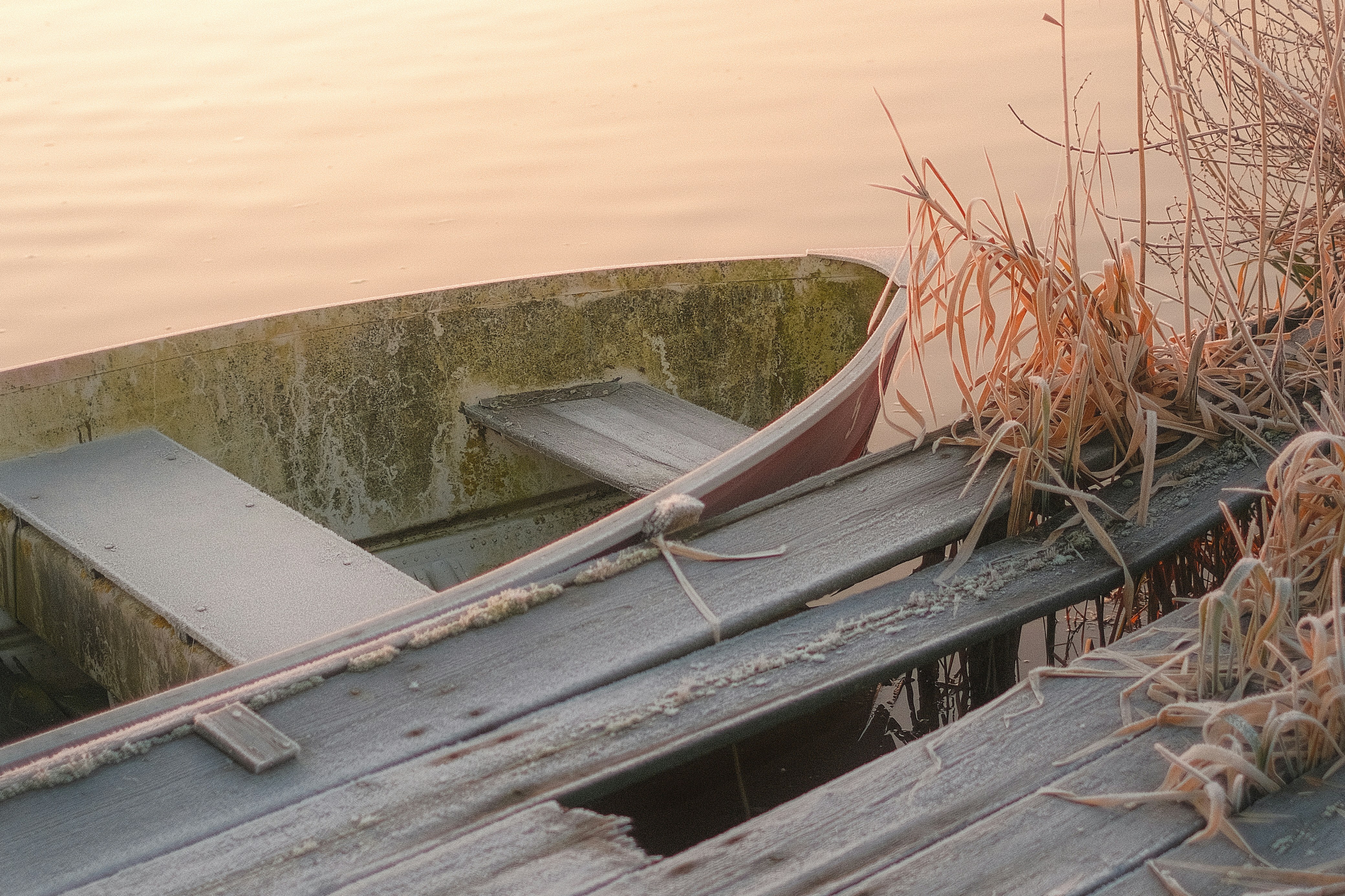 Dusk on Weathered Planks: a Quiet Rowboat by the Lakeside