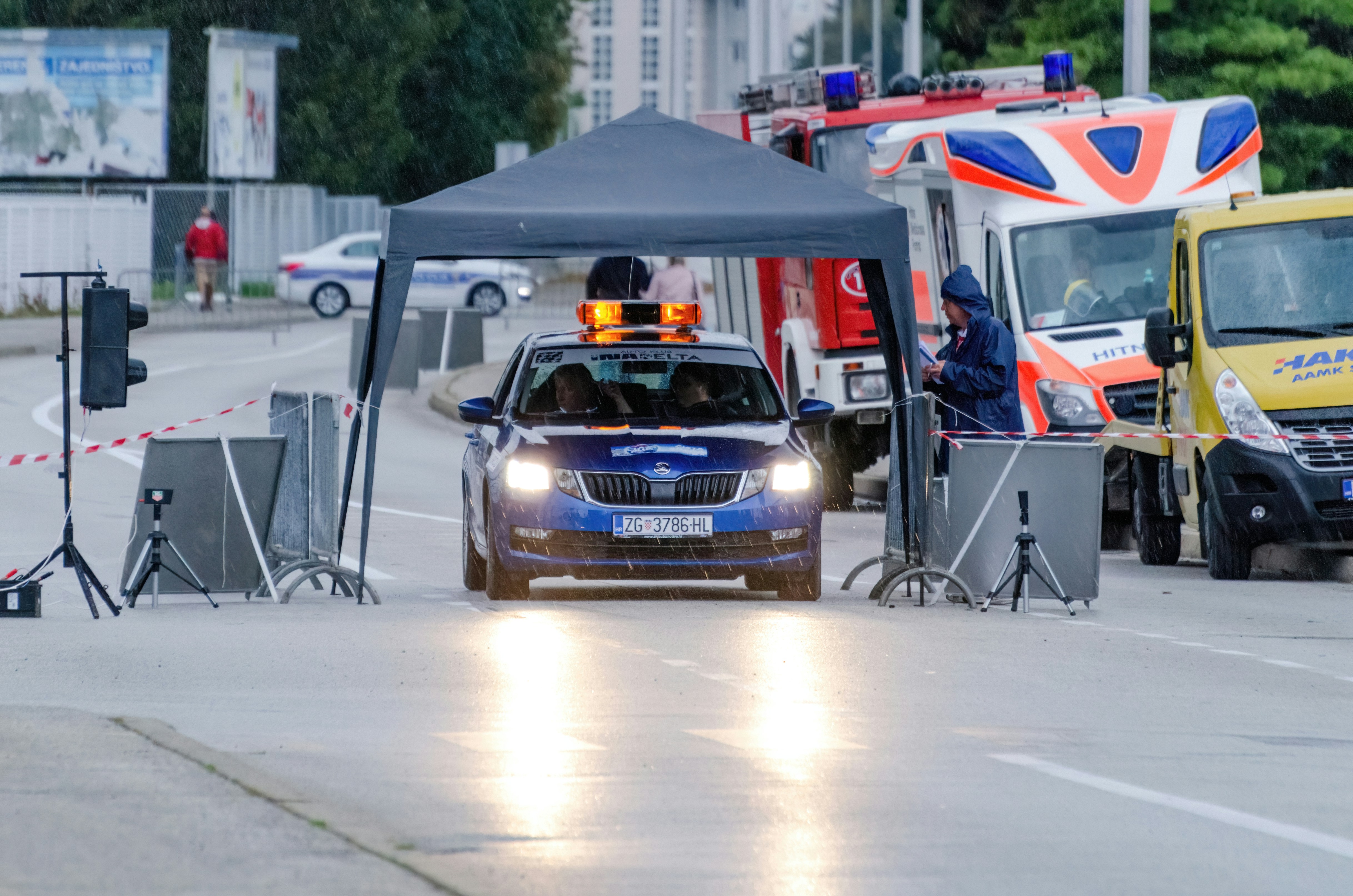 A police car driving down a city street photo – Free Zagrebački ...