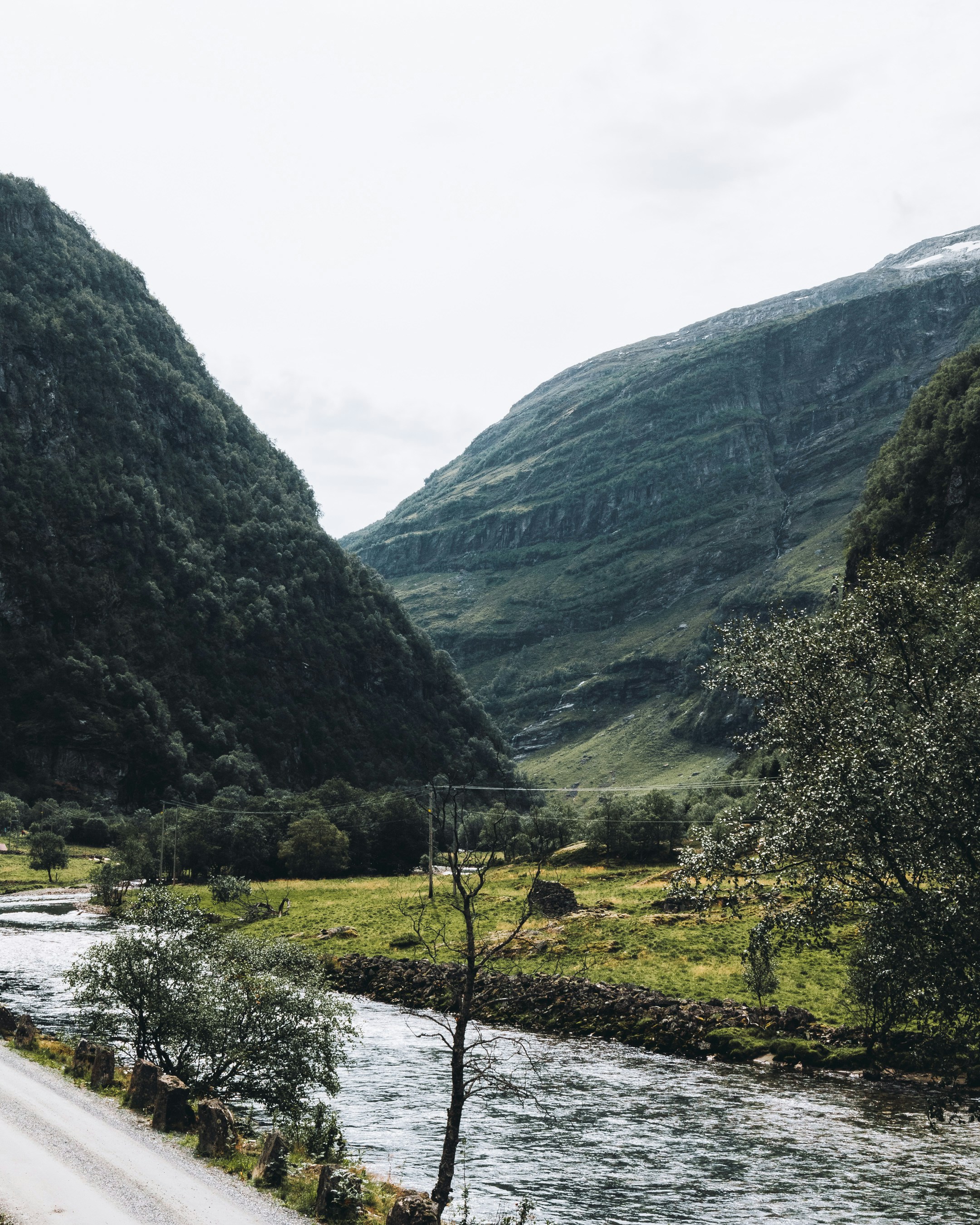 Whispering River Through a Green Valley Beneath Quiet Peaks