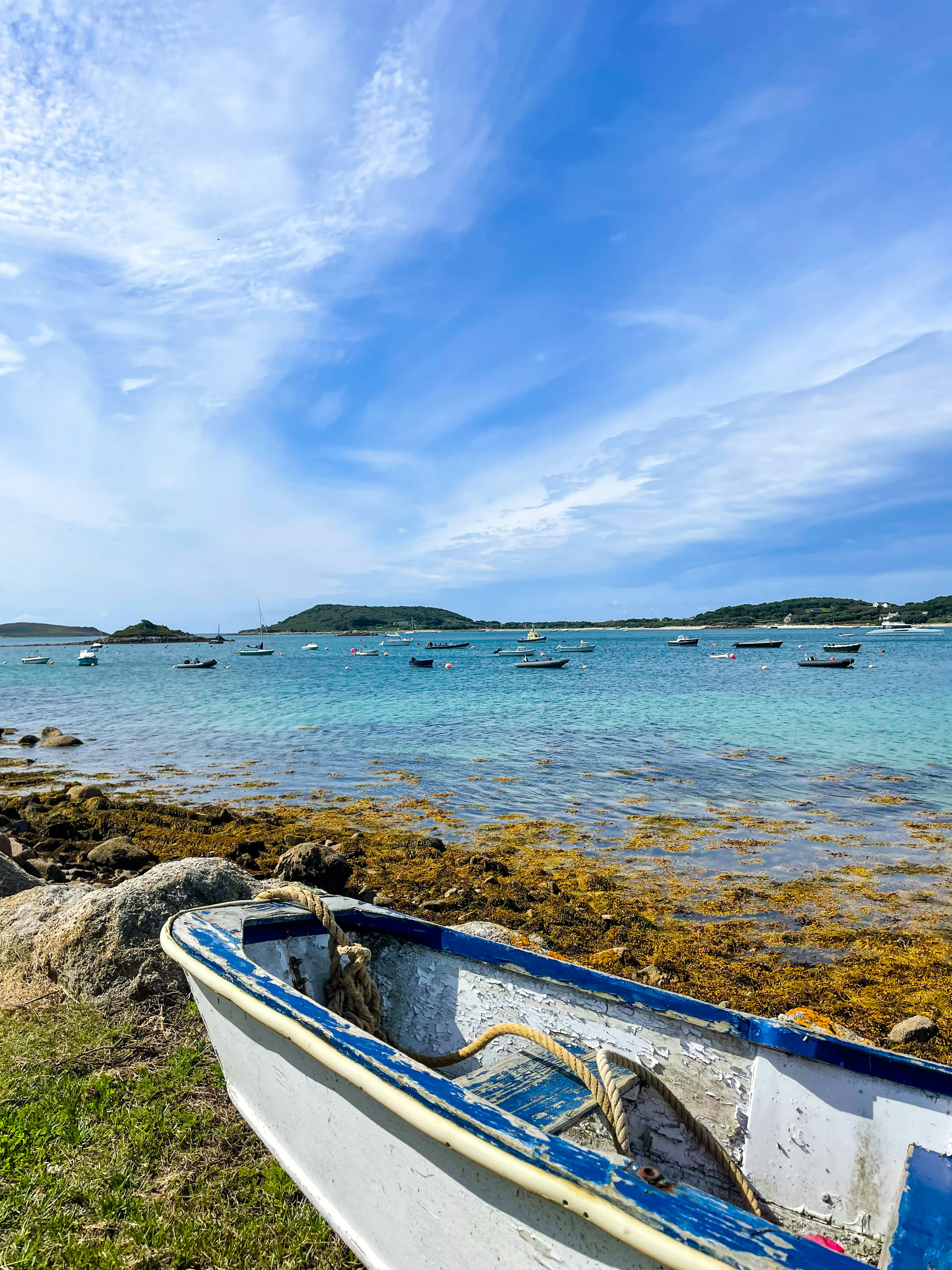 Blue Boat at Cedar Cove: A Quiet Seascape with a Weathered Rowboat