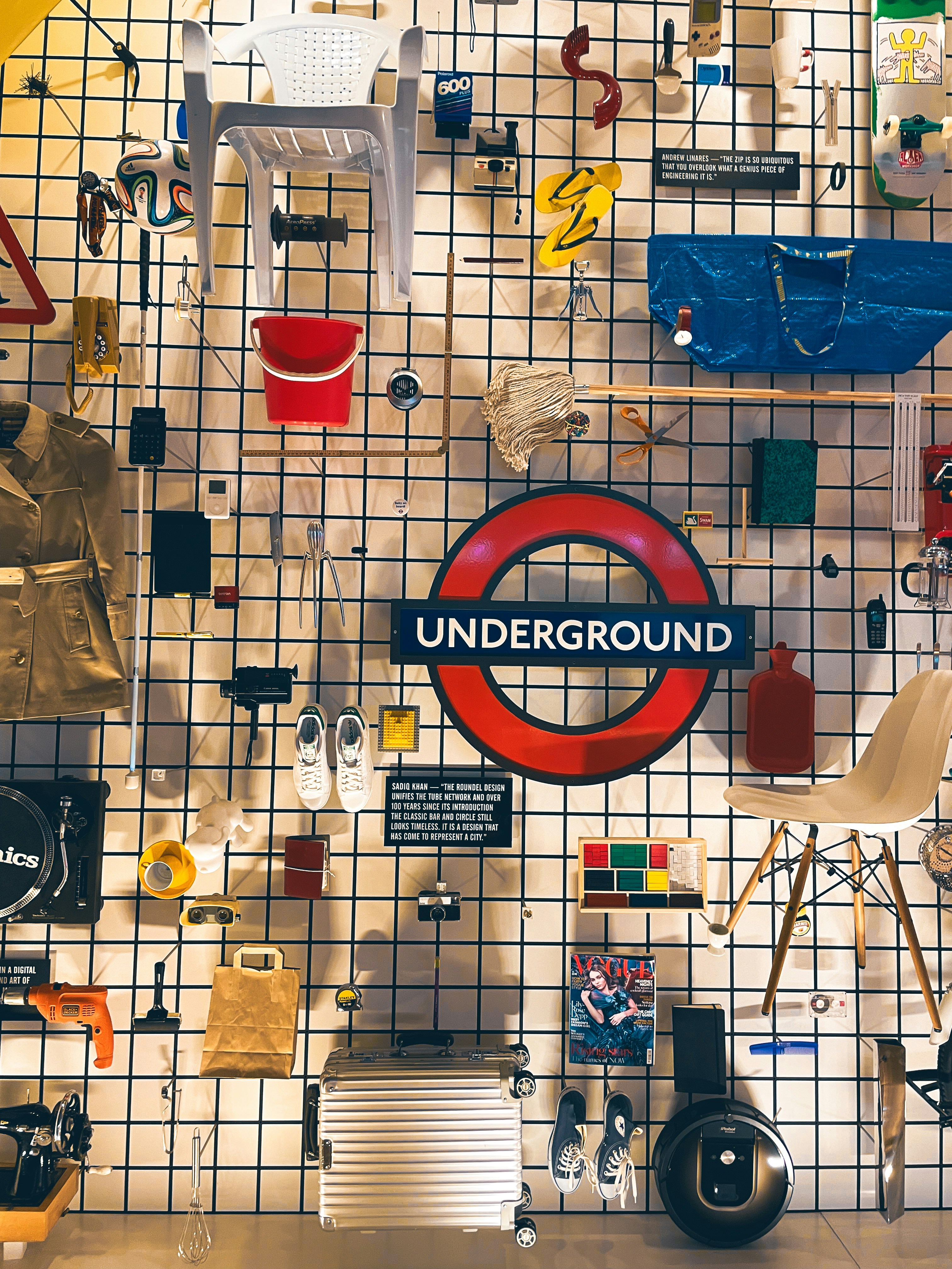 Roundel Rendezvous: A London Underground Emblem Amidst a Wall of Everyday Treasures