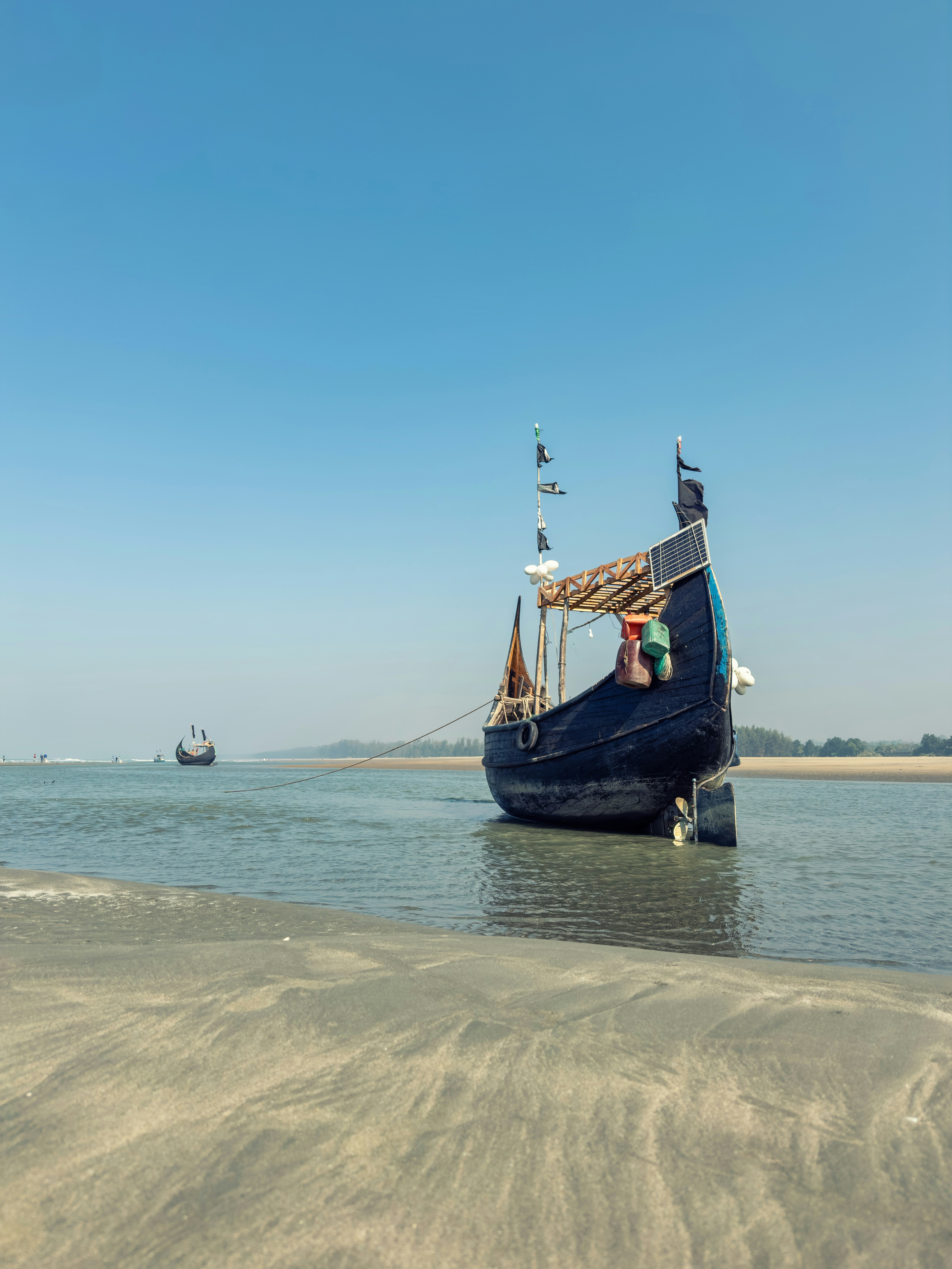 Blue Dhow at the Edge of Tide: Quiet Sentinel of the Estuary