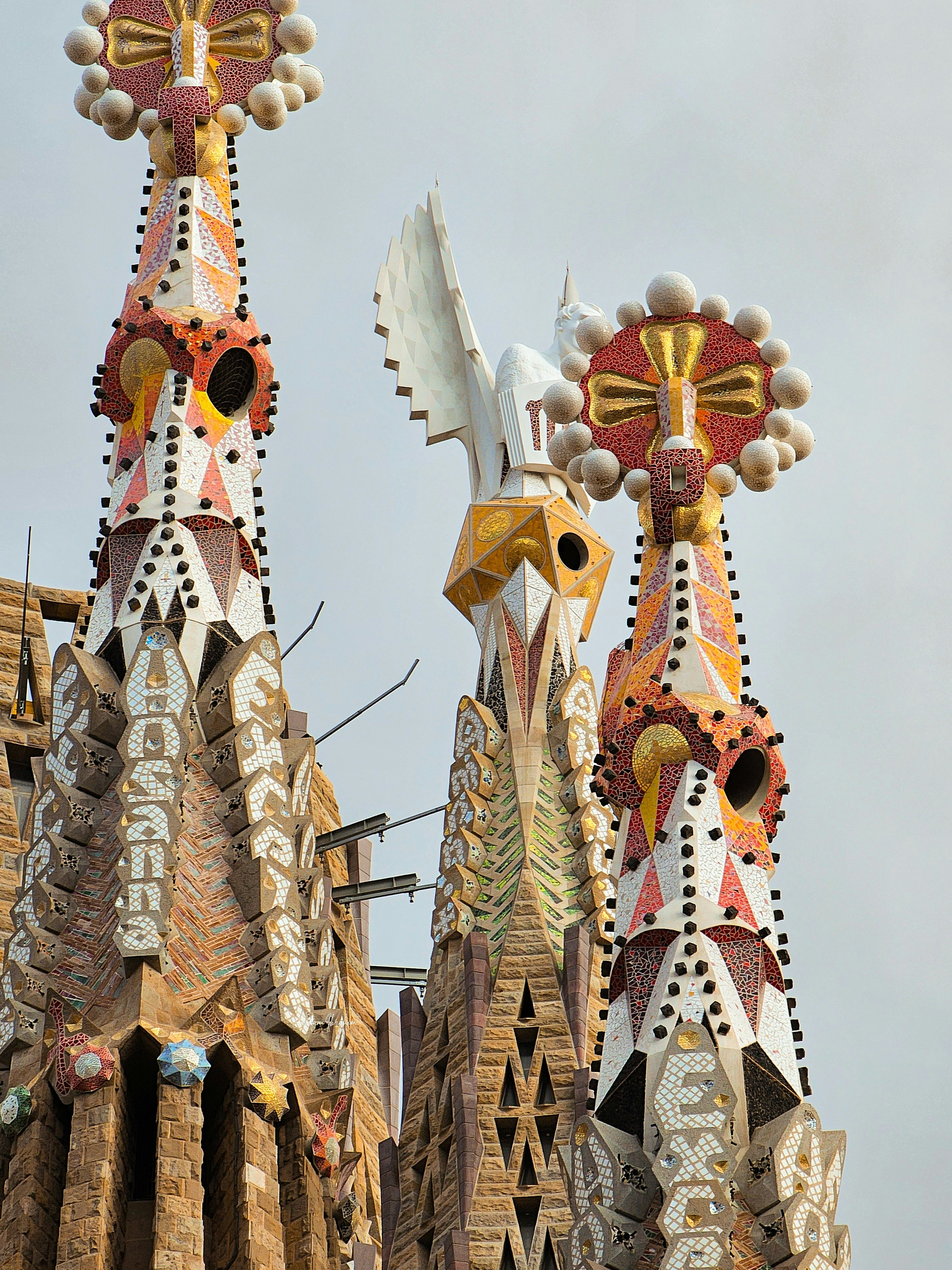 Orb-Crowned Mosaic Towers Under a Pale Sky