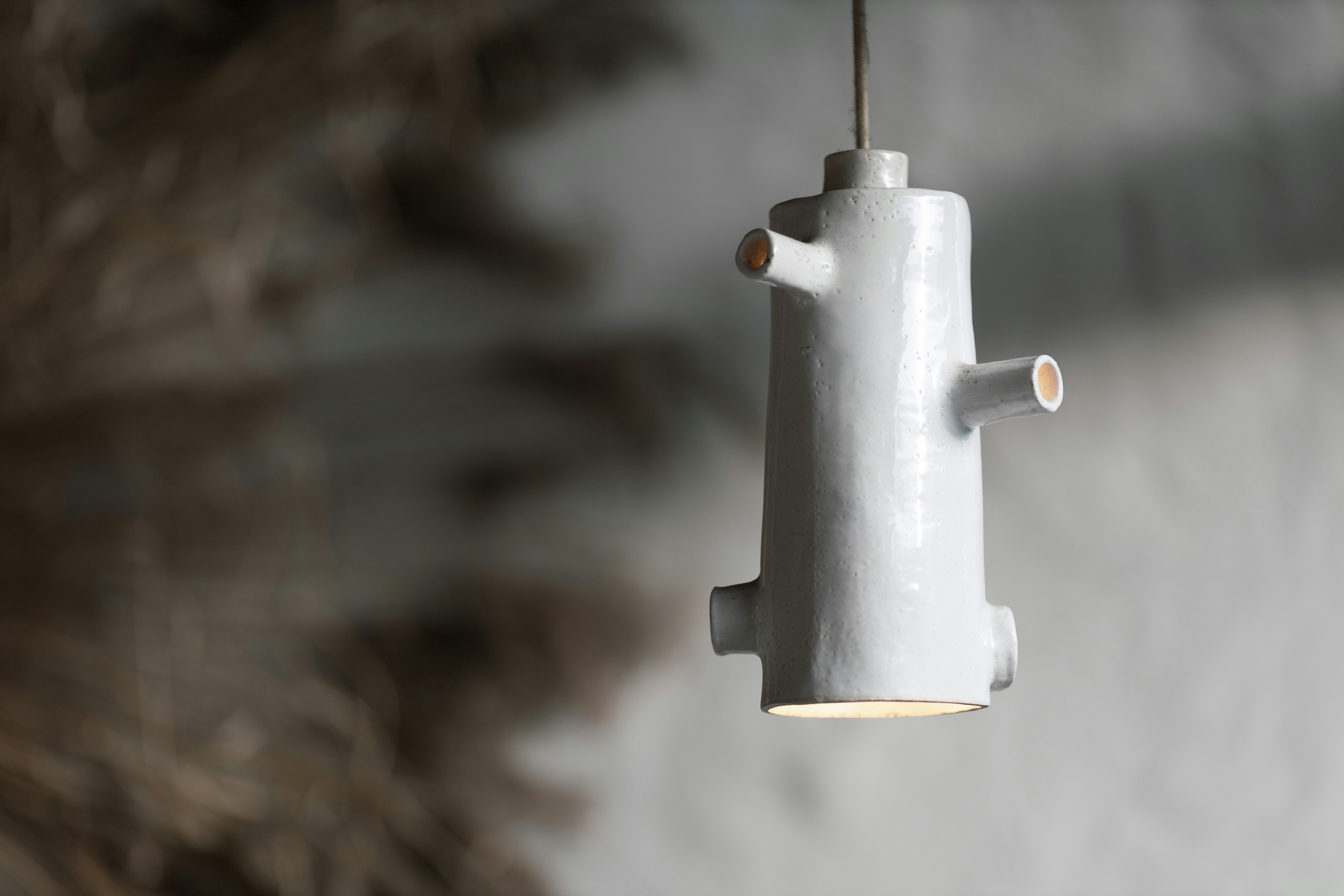 Hanging White Pendant in Soft Focus: A Minimalist Moment
