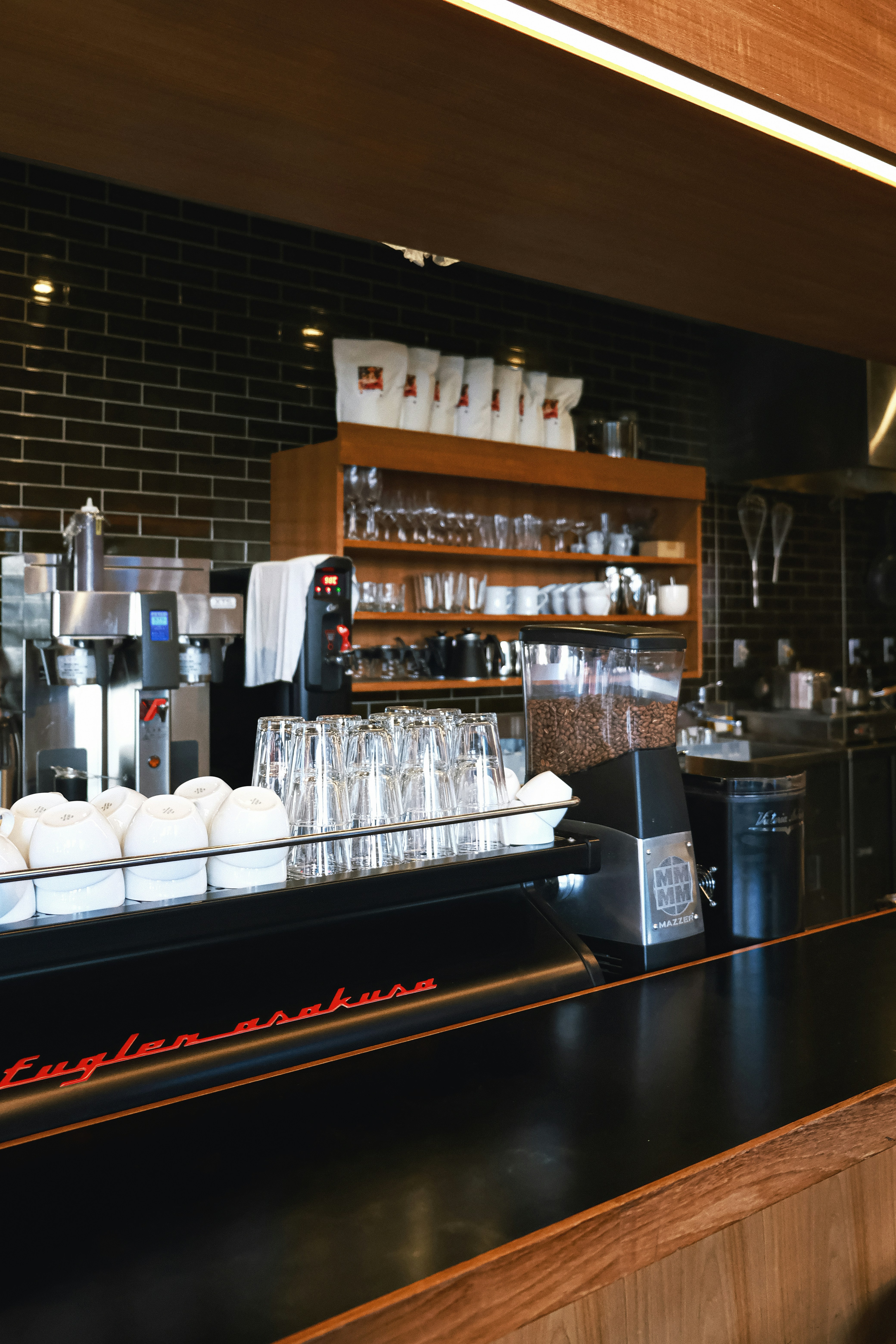 A bar with a bunch of glasses on it photo – Free Coffee Image on Unsplash