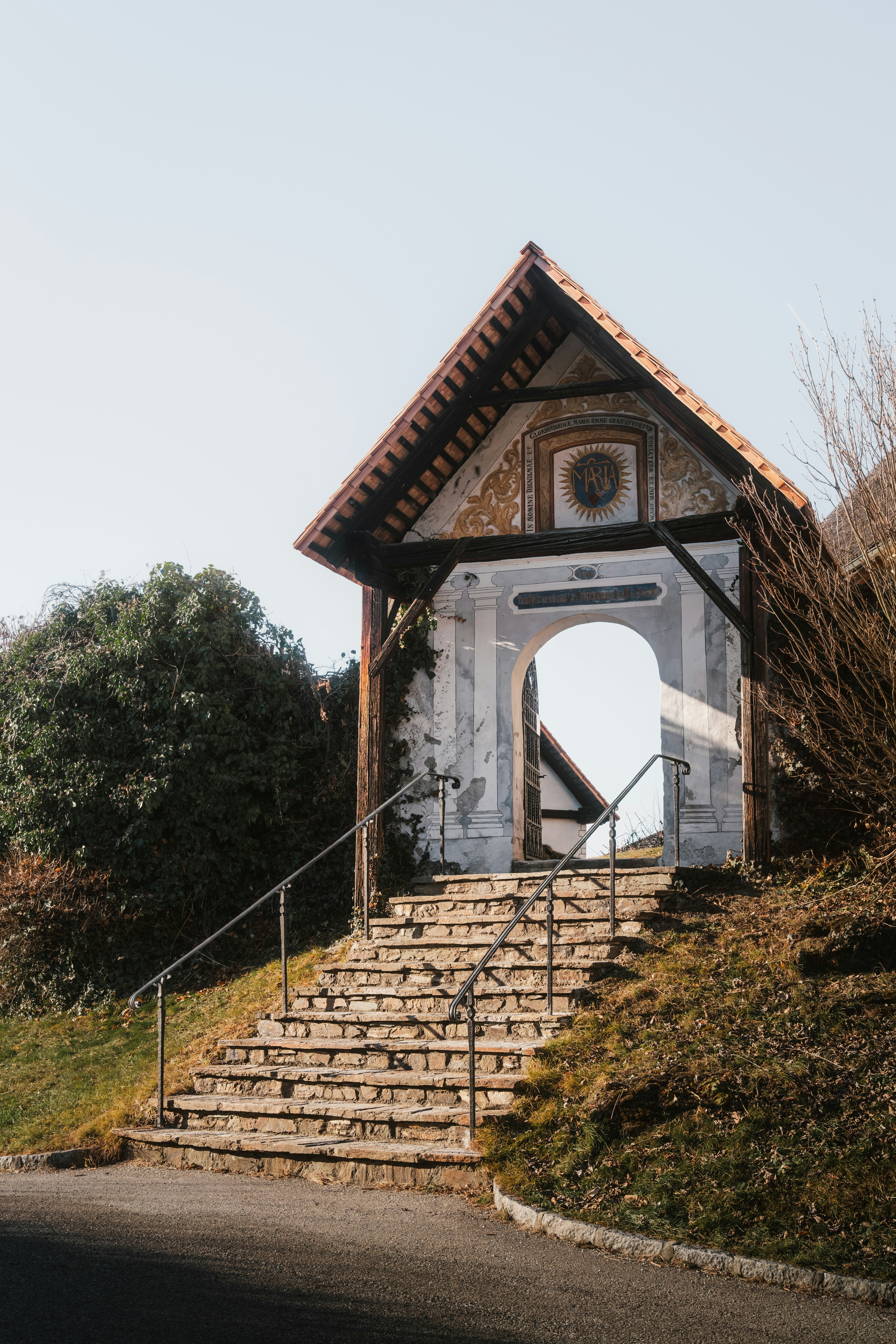 Arched Gatehouse at the Summit of a Weathered Staircase