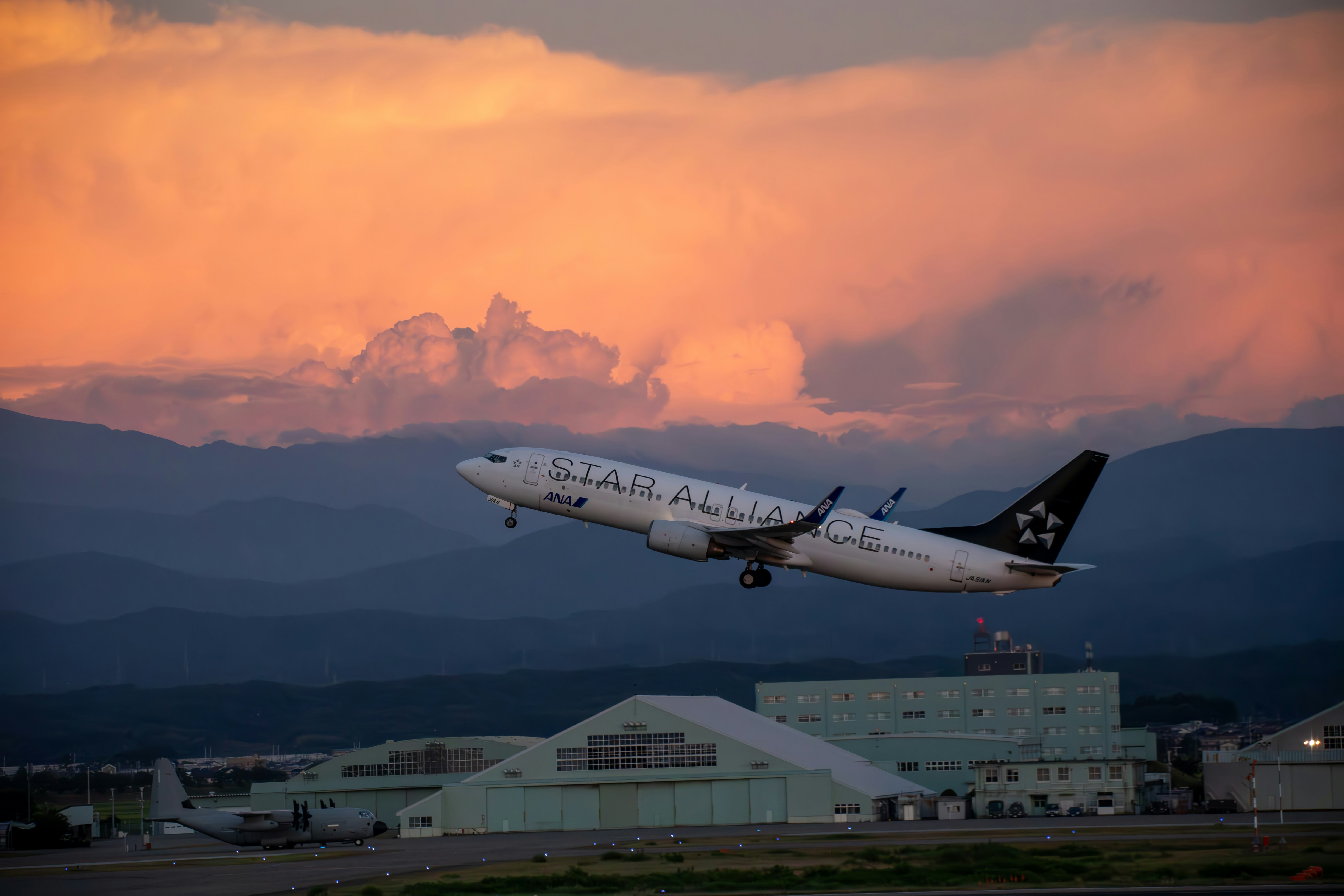 Jetliner Ascension Against a Fiery Horizon