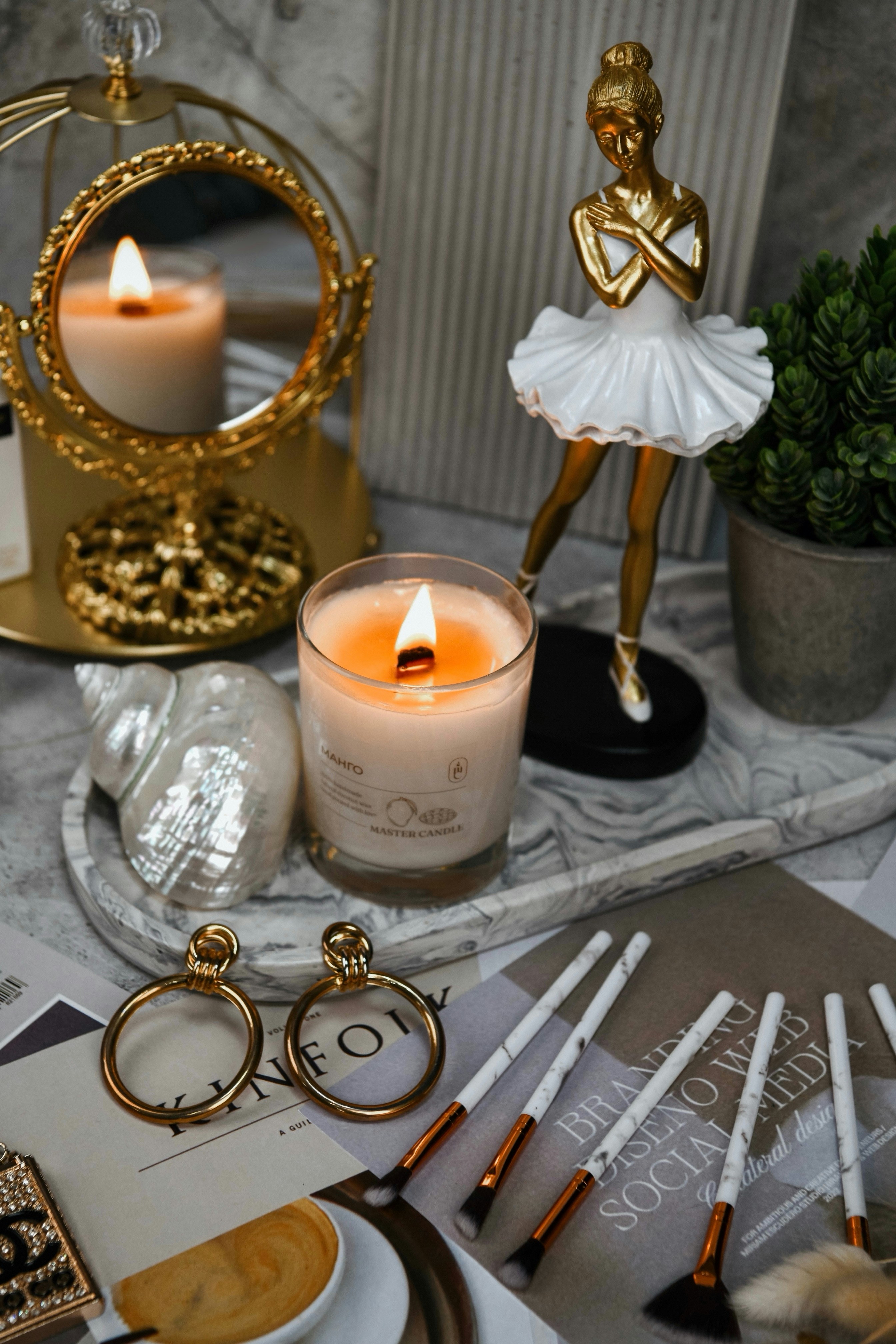 Candlelight Ballet: A Marble Still-Life with Gold Figurine and Trinkets