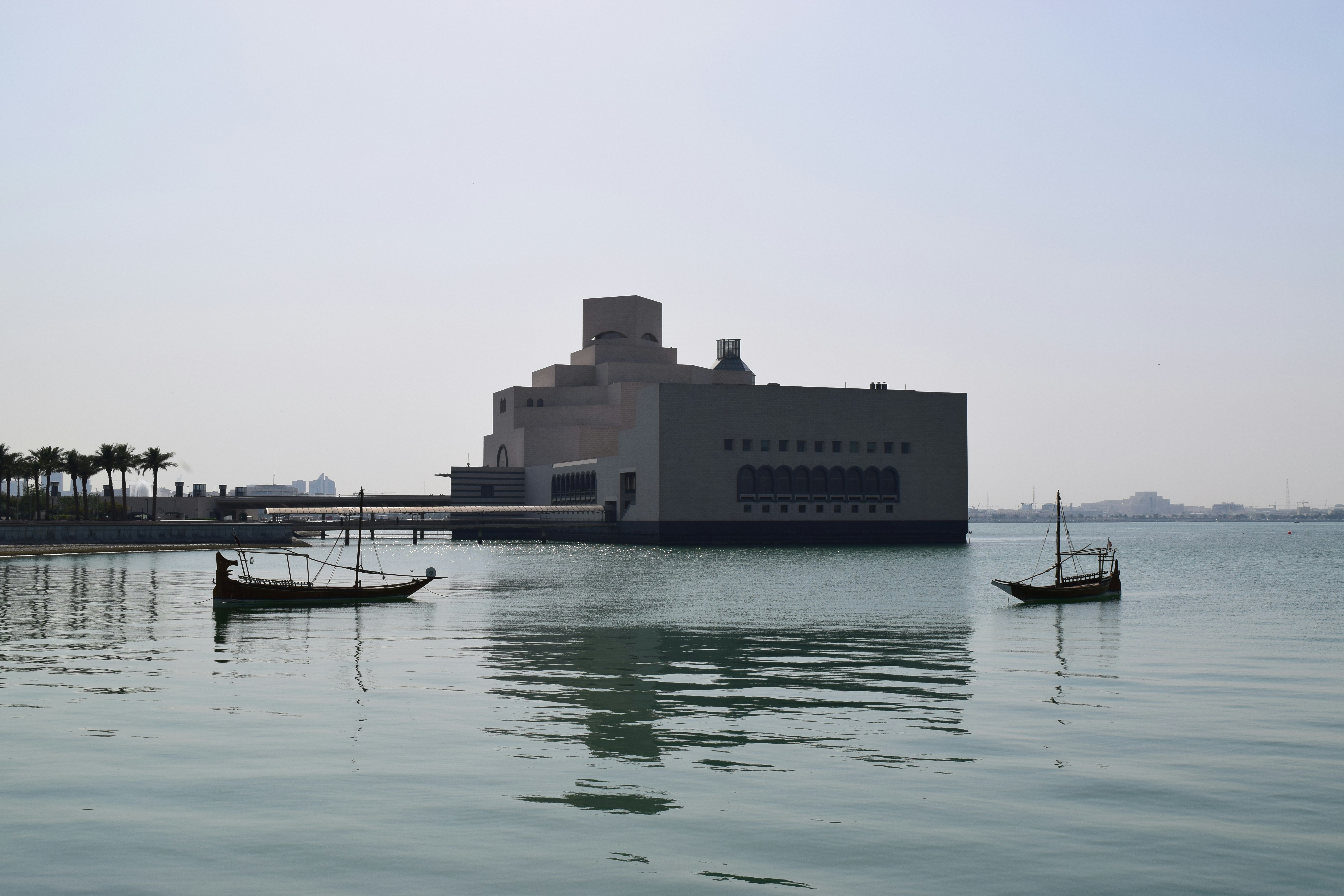 Geometric Monument Over a Glassy Harbor