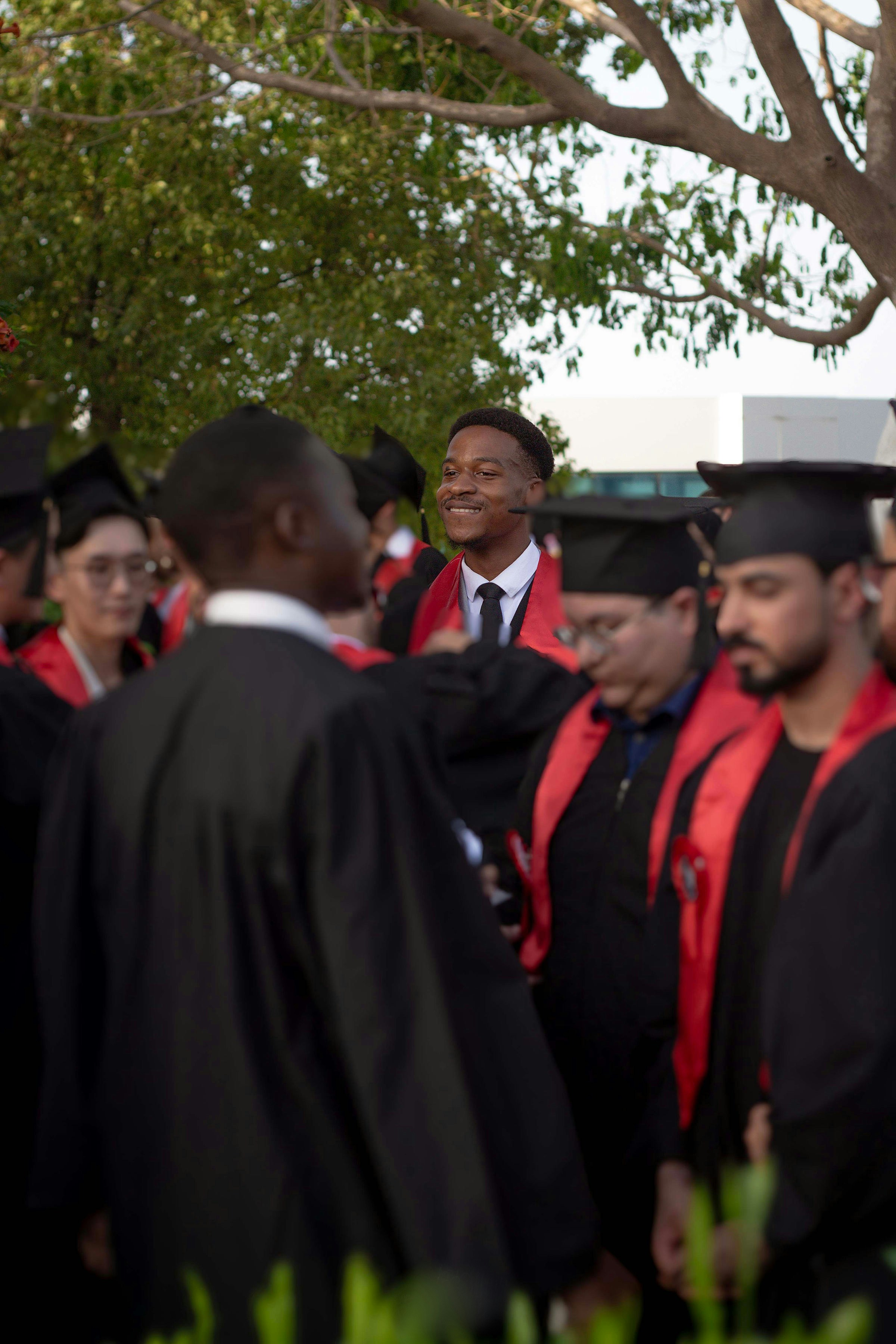 A group of people in graduation gowns and hats photo – Free University ...