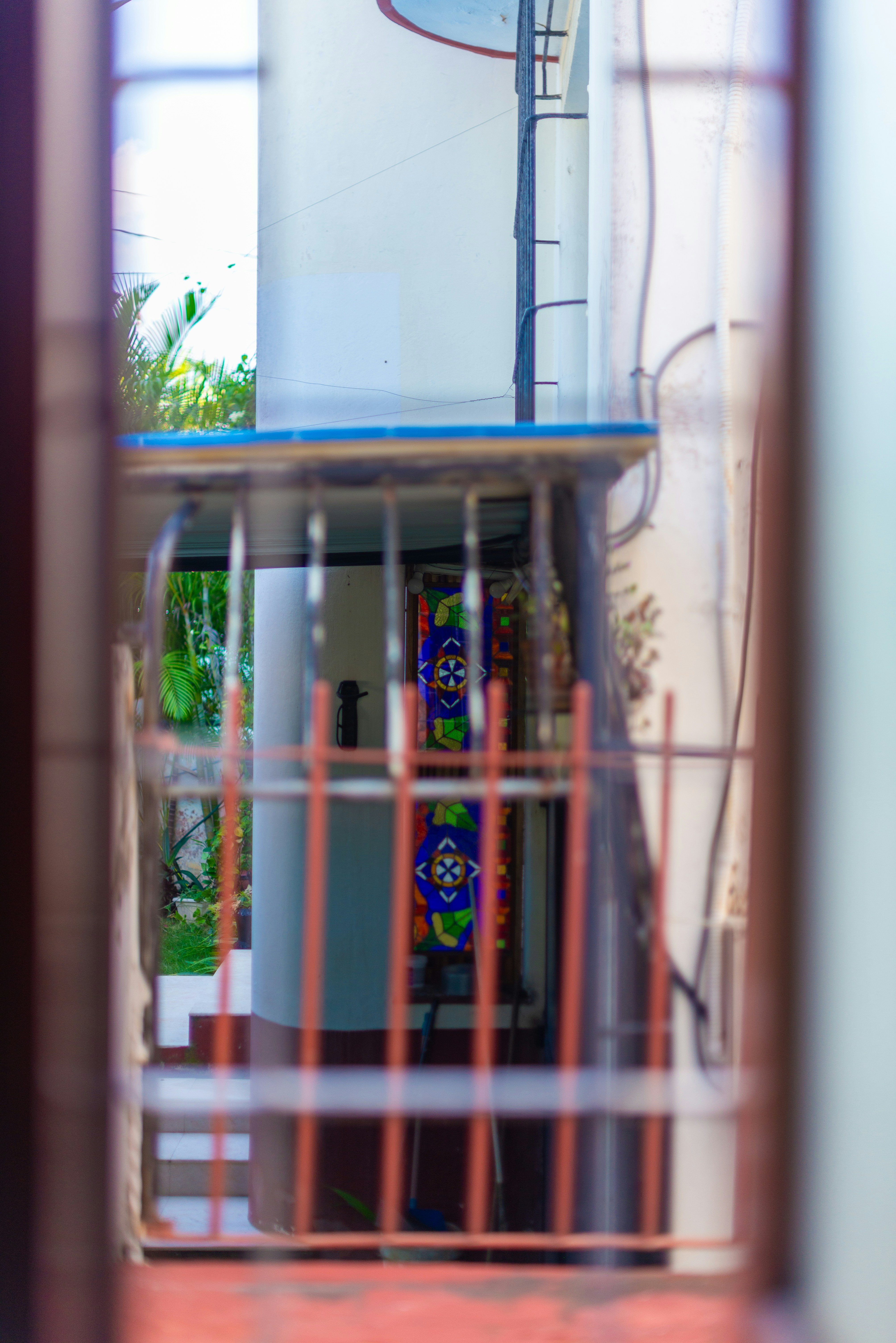 A view of a building through a window photo – Free Art Image on Unsplash