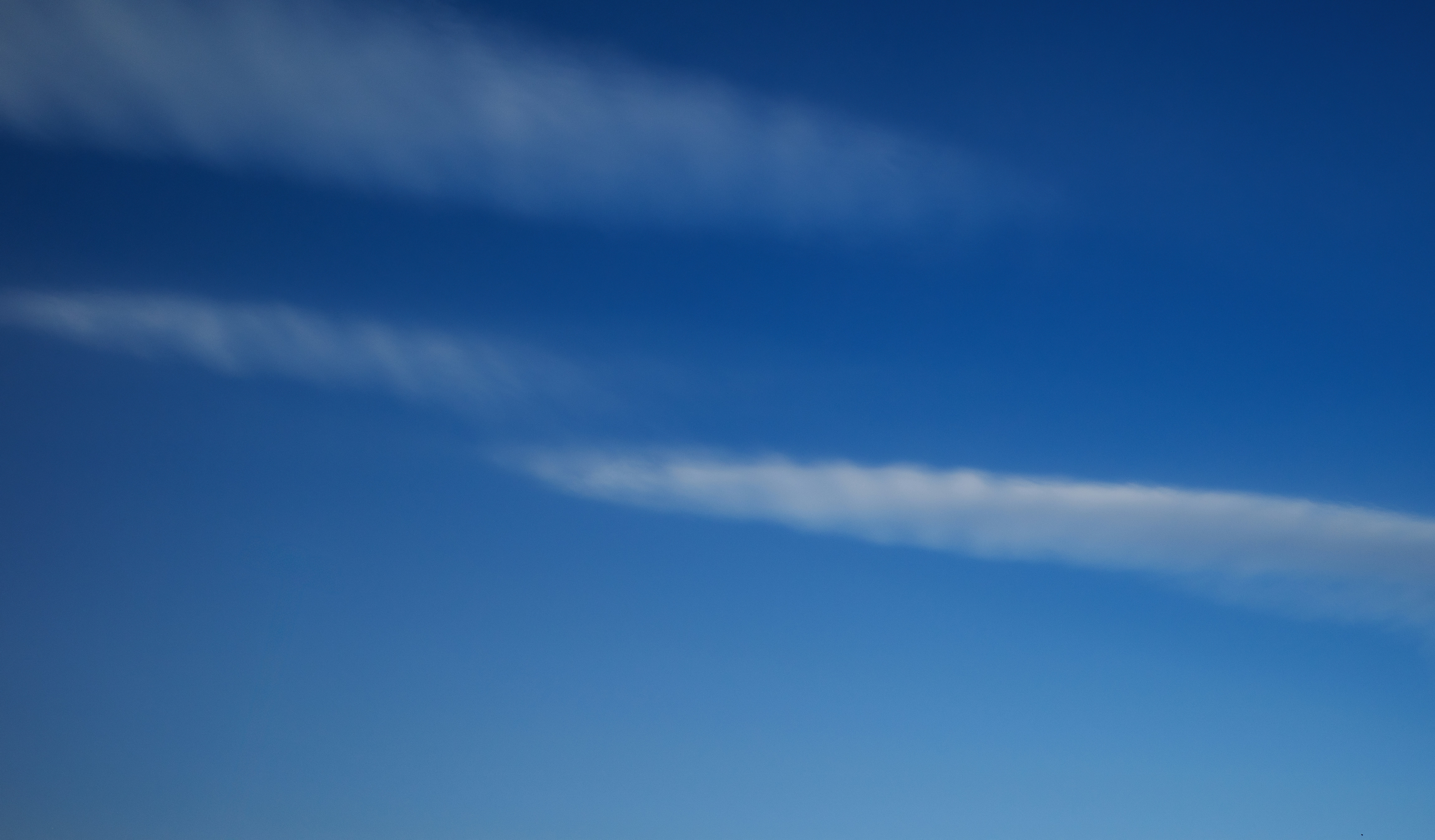 Strata of Sky: High Altitude Blue with Cloud Ribbons