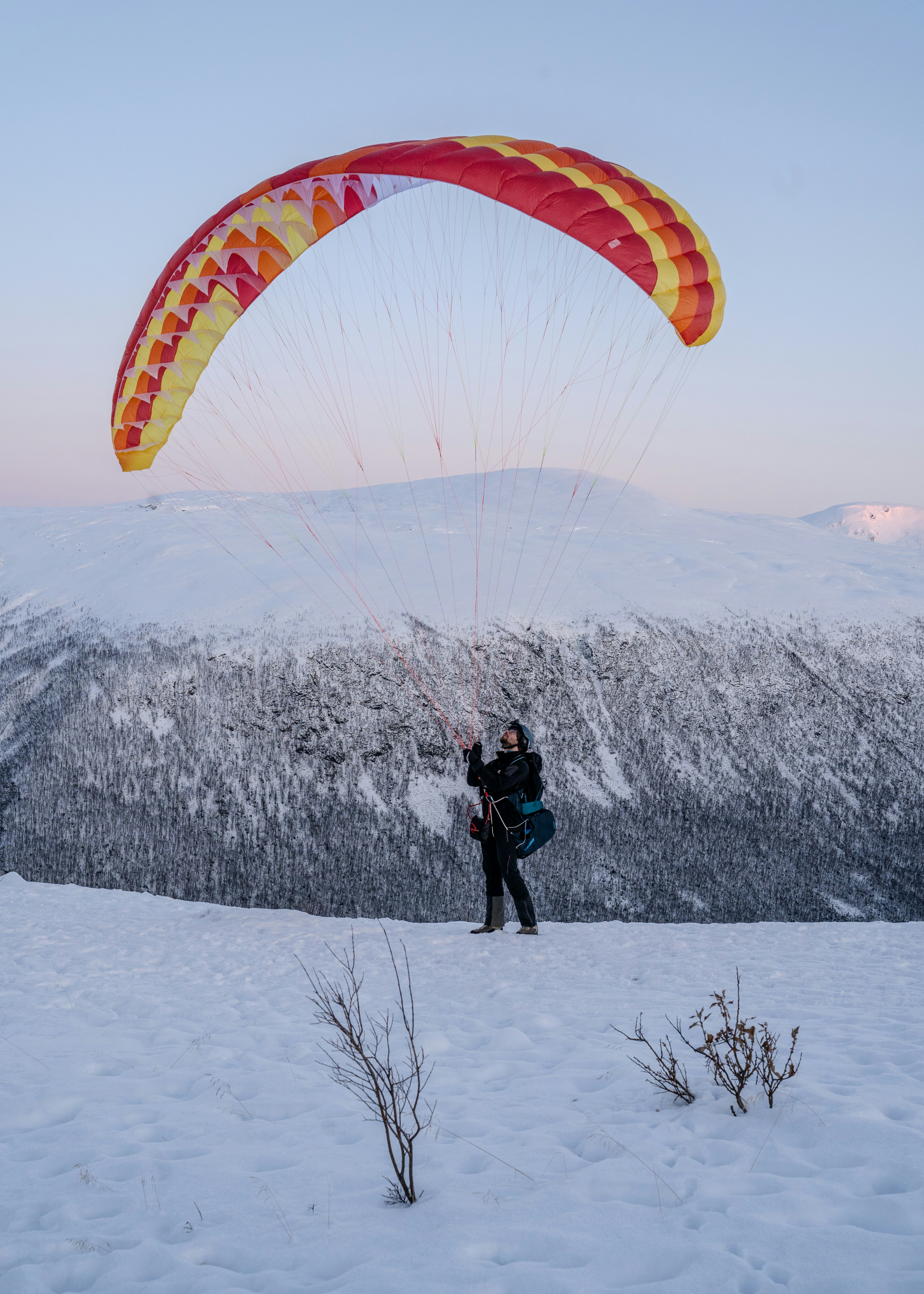 A person standing on top of a snow covered slope photo – Free Human ...