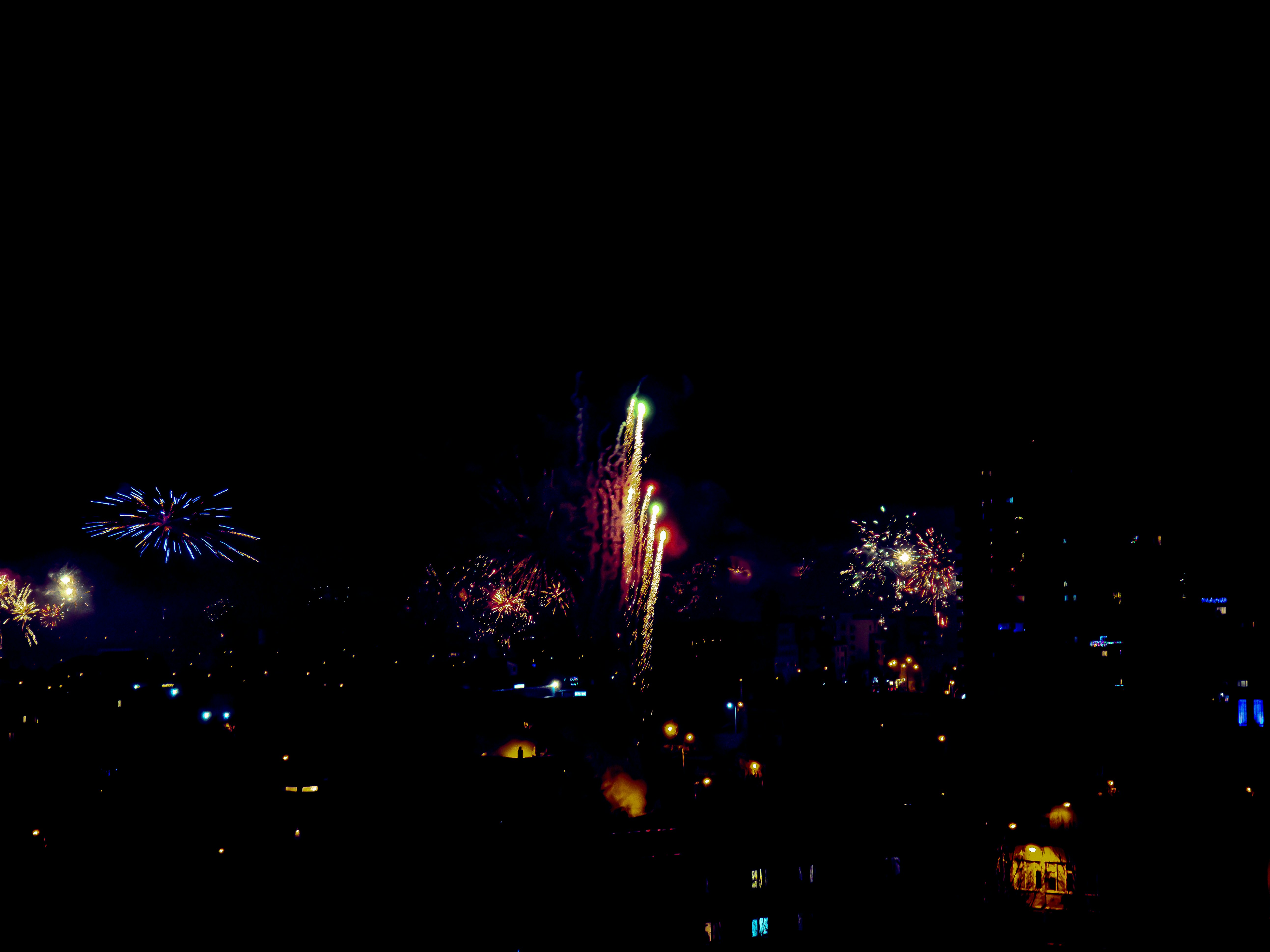 Urban Nightscape Ablaze with Fireworks