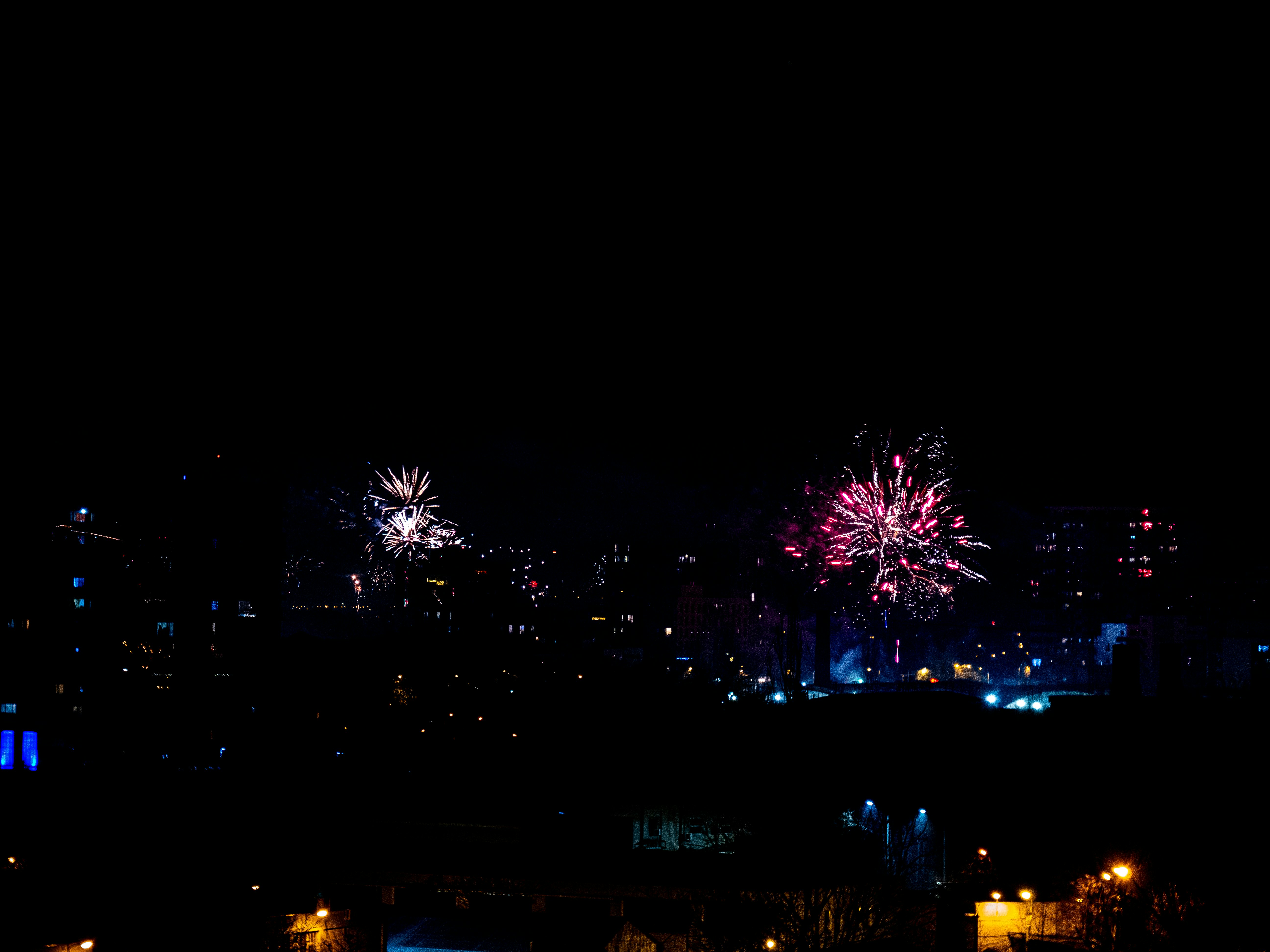 Urban Nightscape Alive with Pyrotechnics