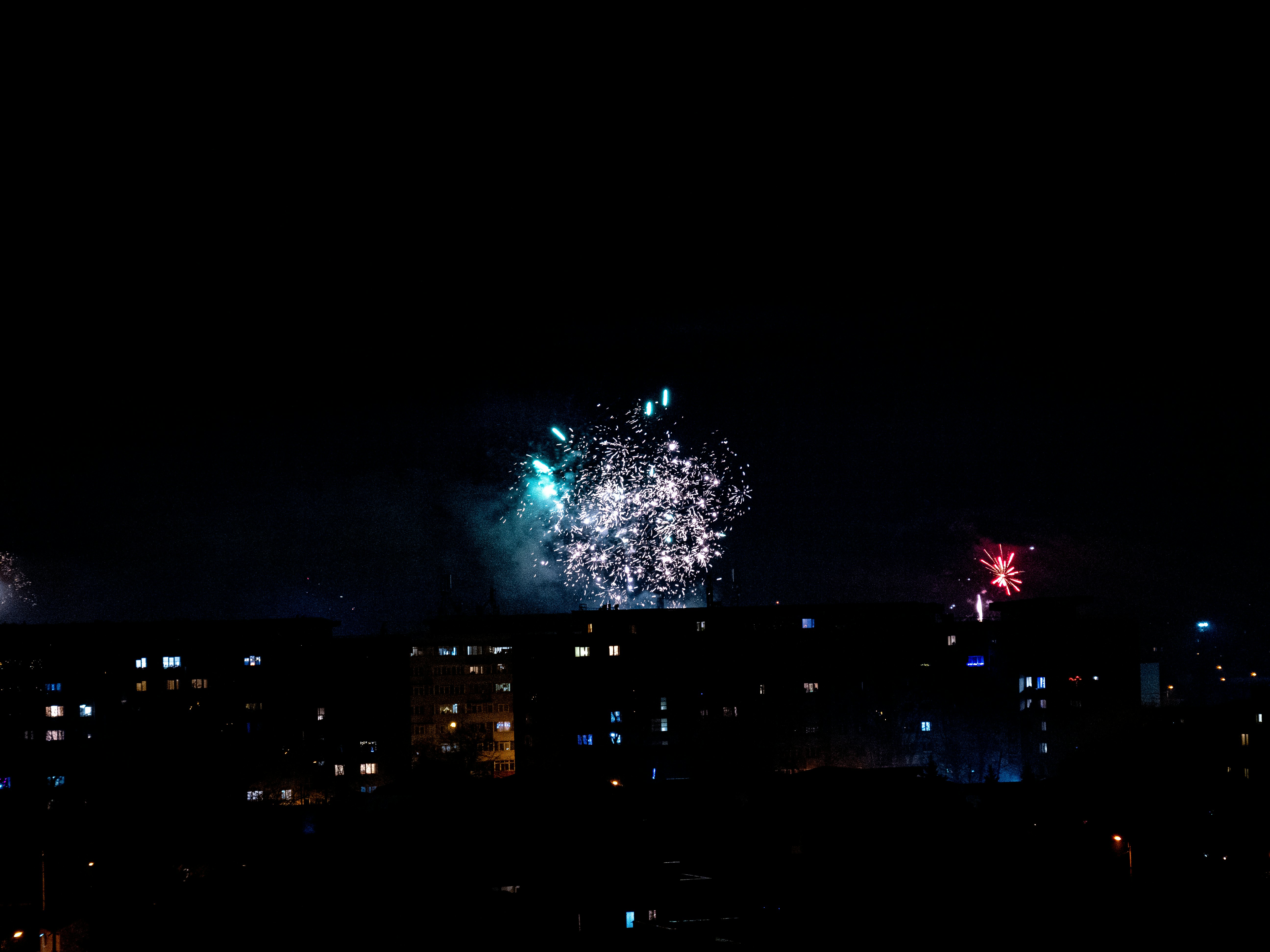Nocturnal Celebration Over Urban Silhouette