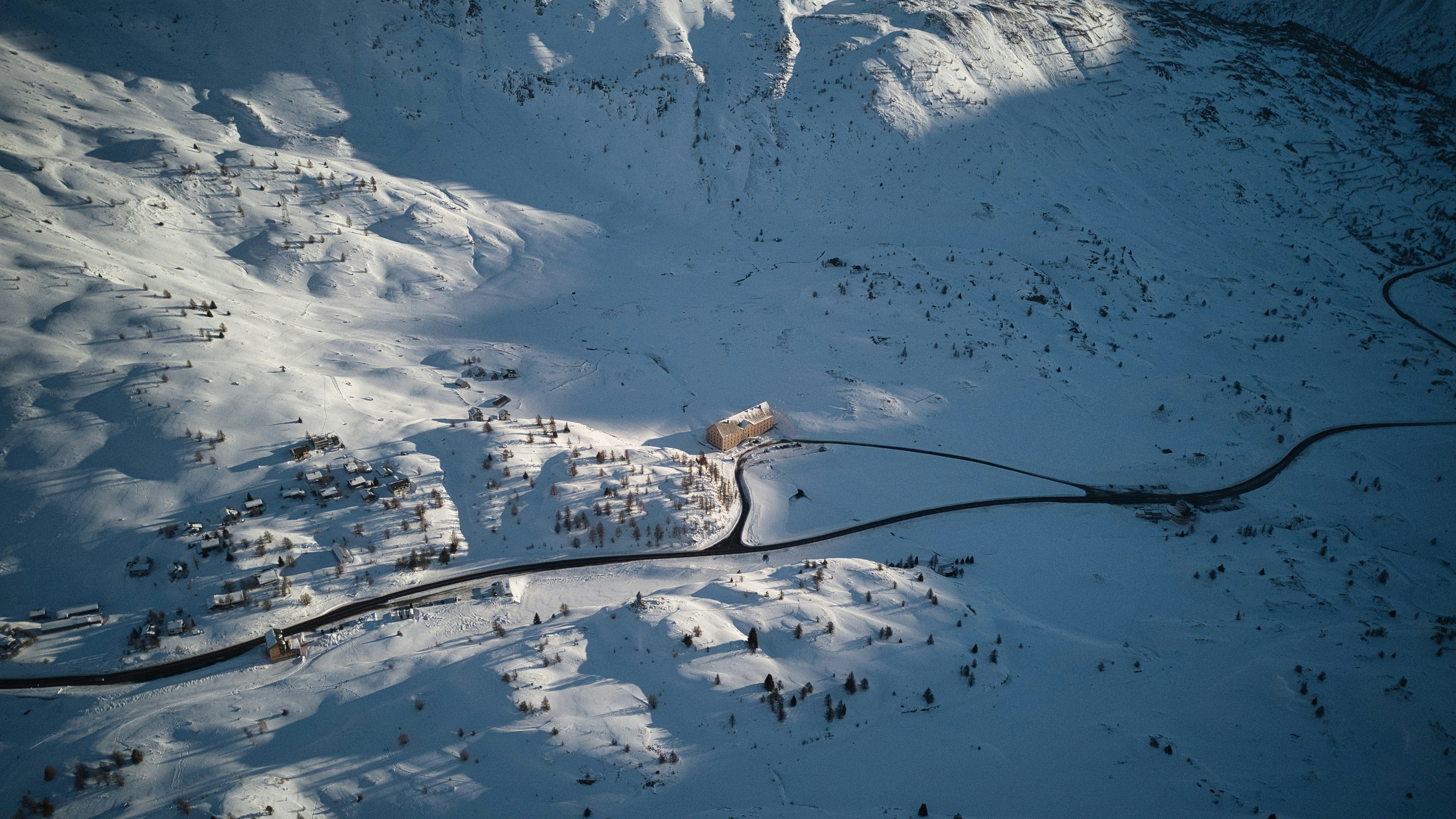 Snow-Weaved Valley: A Drone’s Quiet Panorama of Roads and Rooftops